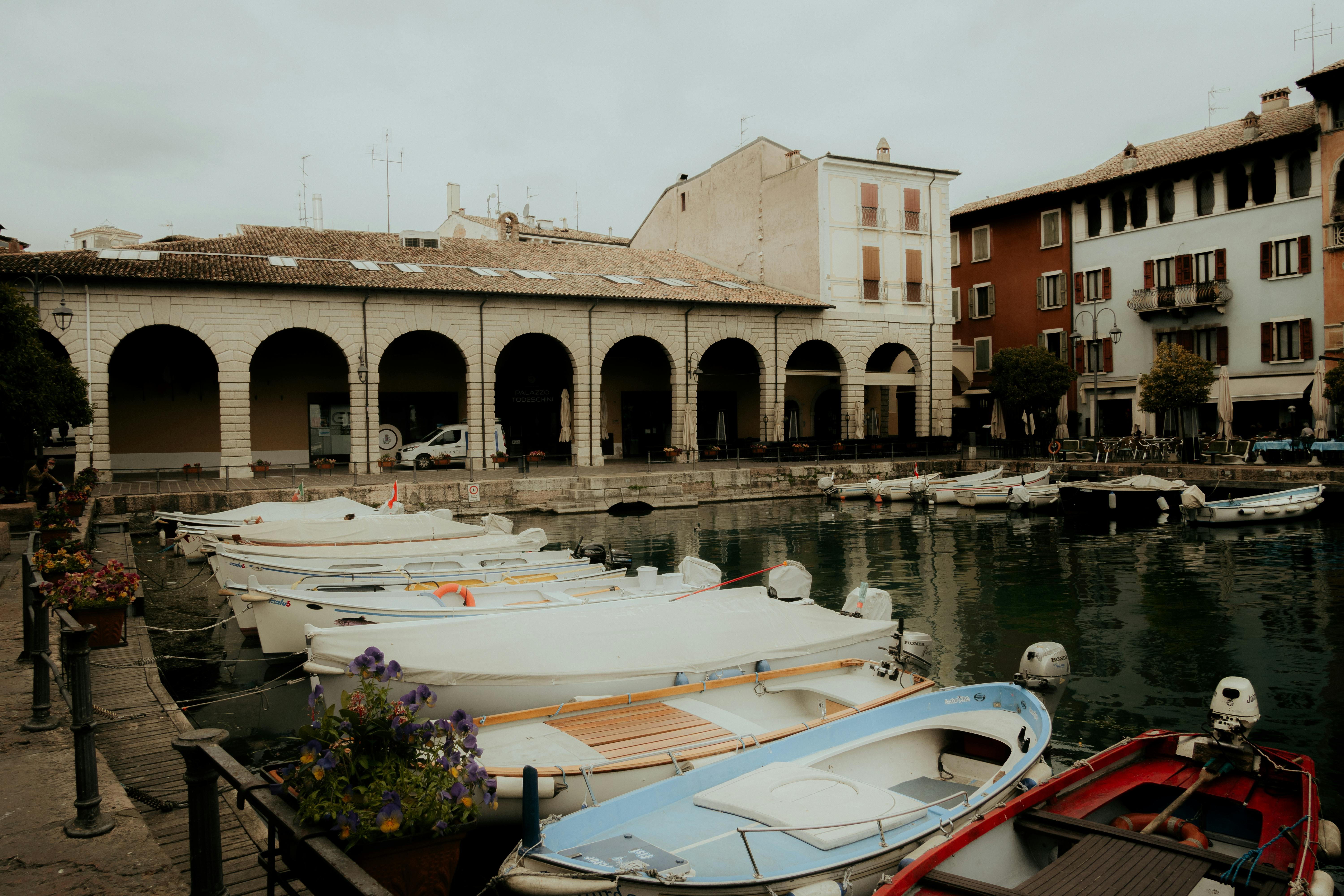 Charming Italian harbor with moored boats in summer · Free Stock Photo