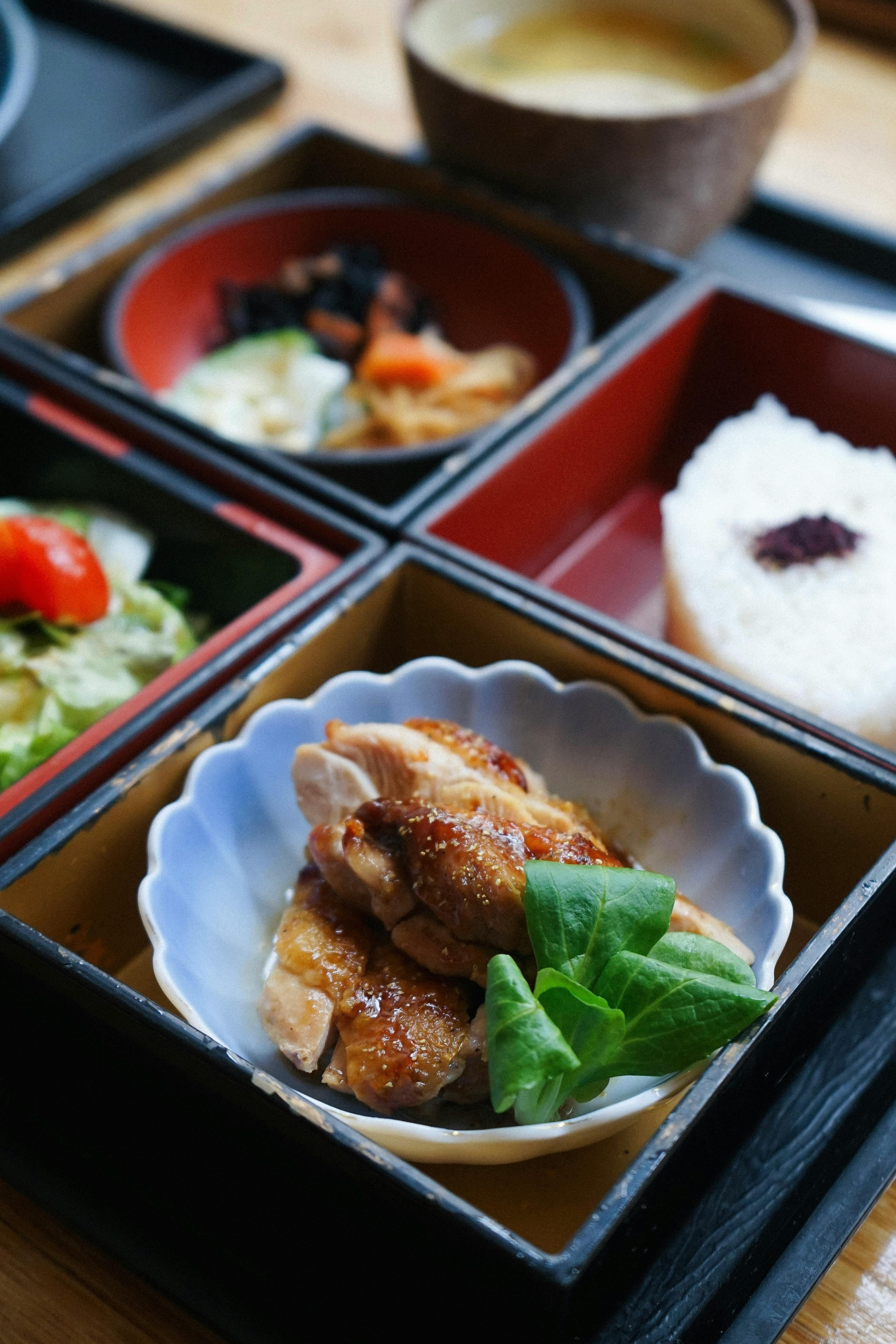 Traditional Japanese Bento Box with Varied Dishes · Free Stock Photo