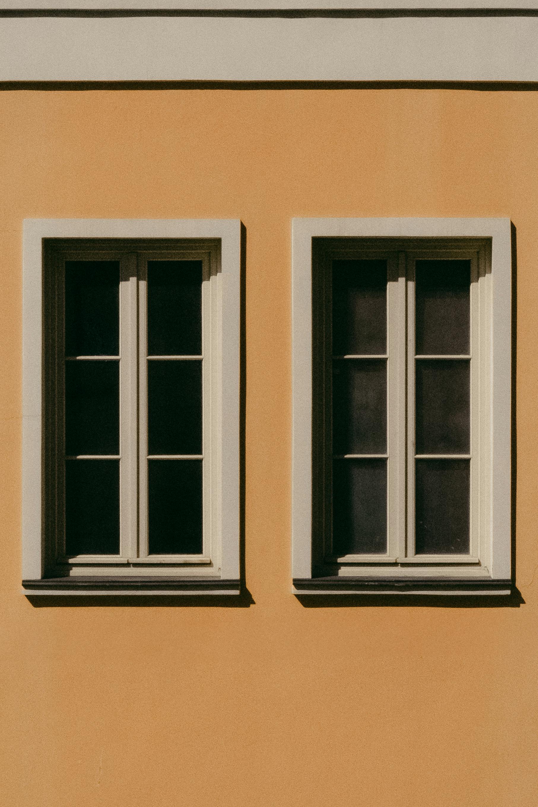 Warm Toned Double Windows on Classic Building · Free Stock Photo
