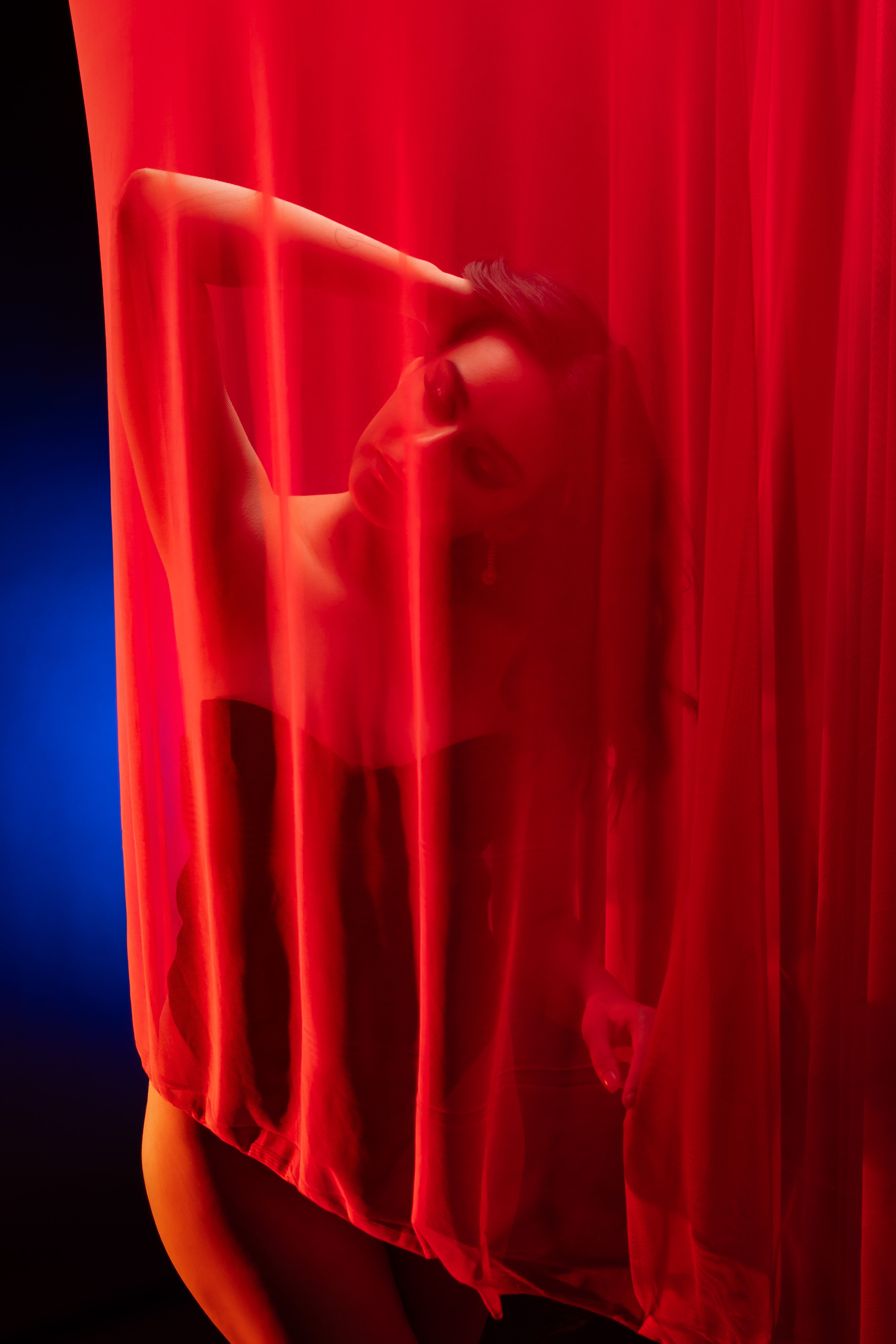 Artistic Portrait Behind Red Curtain · Free Stock Photo
