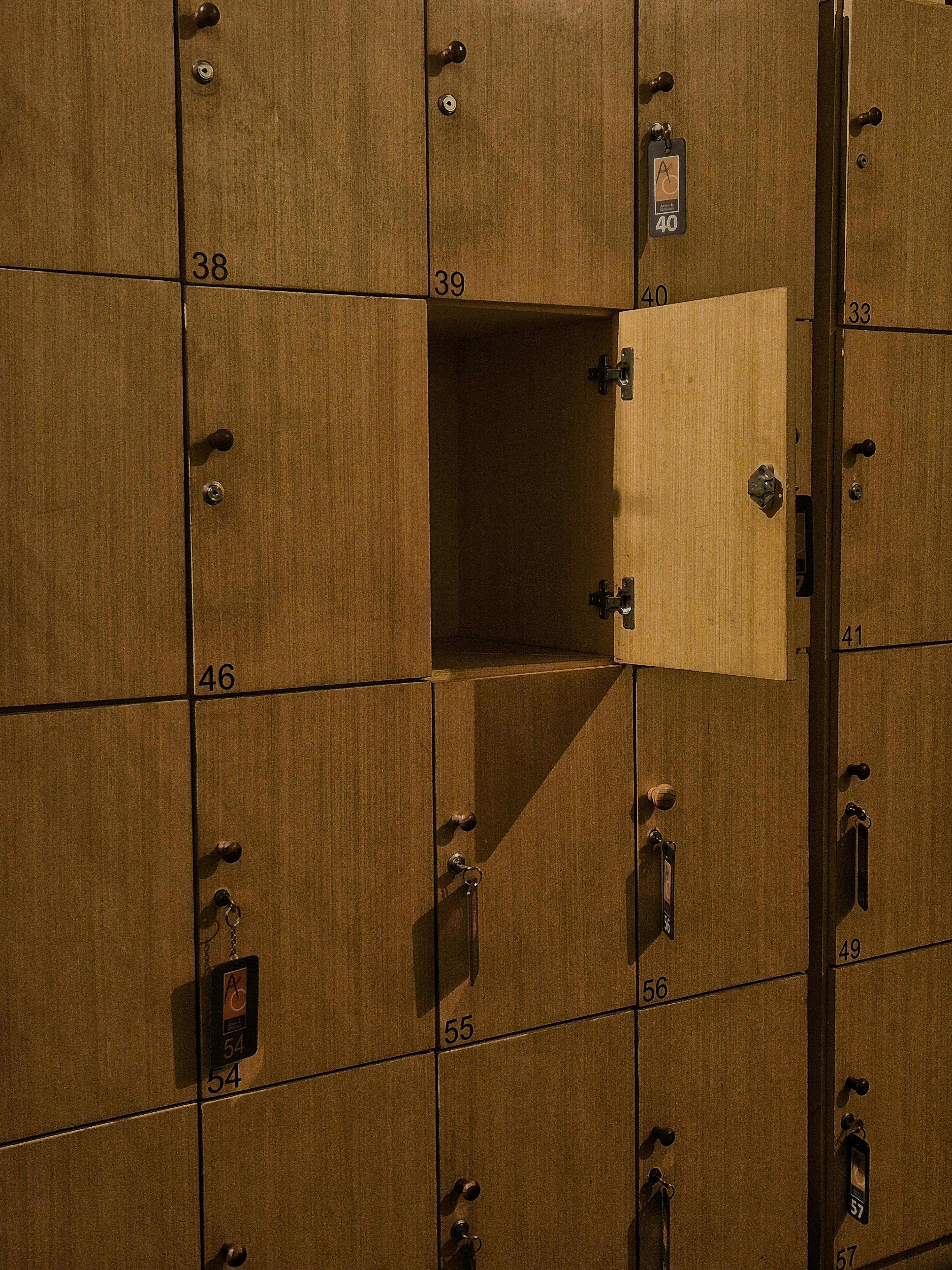 Open Locker in Wooden Locker Room · Free Stock Photo