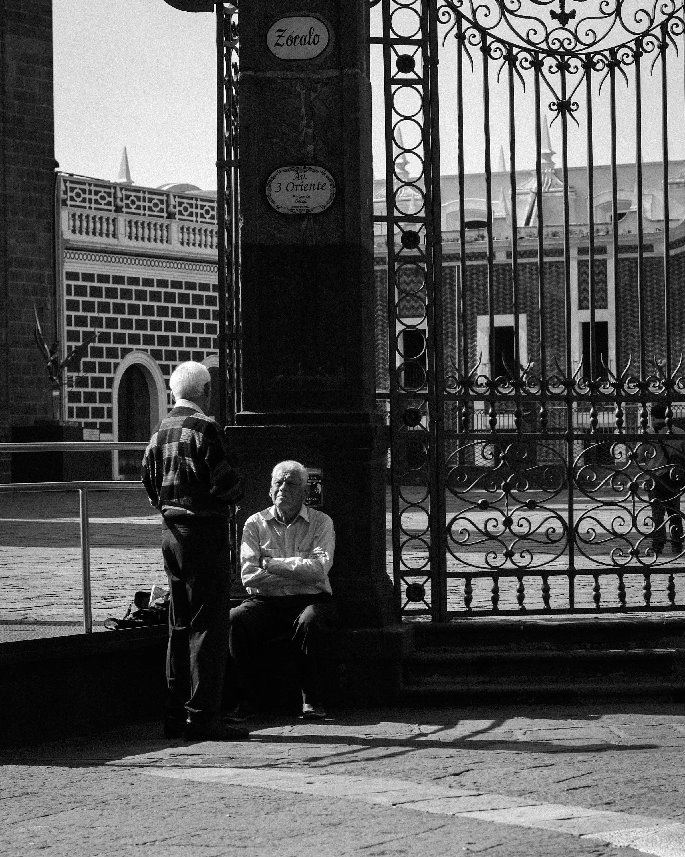 Historic Zócalo Gate in Puebla with Two Elderly Men · Free Stock Photo