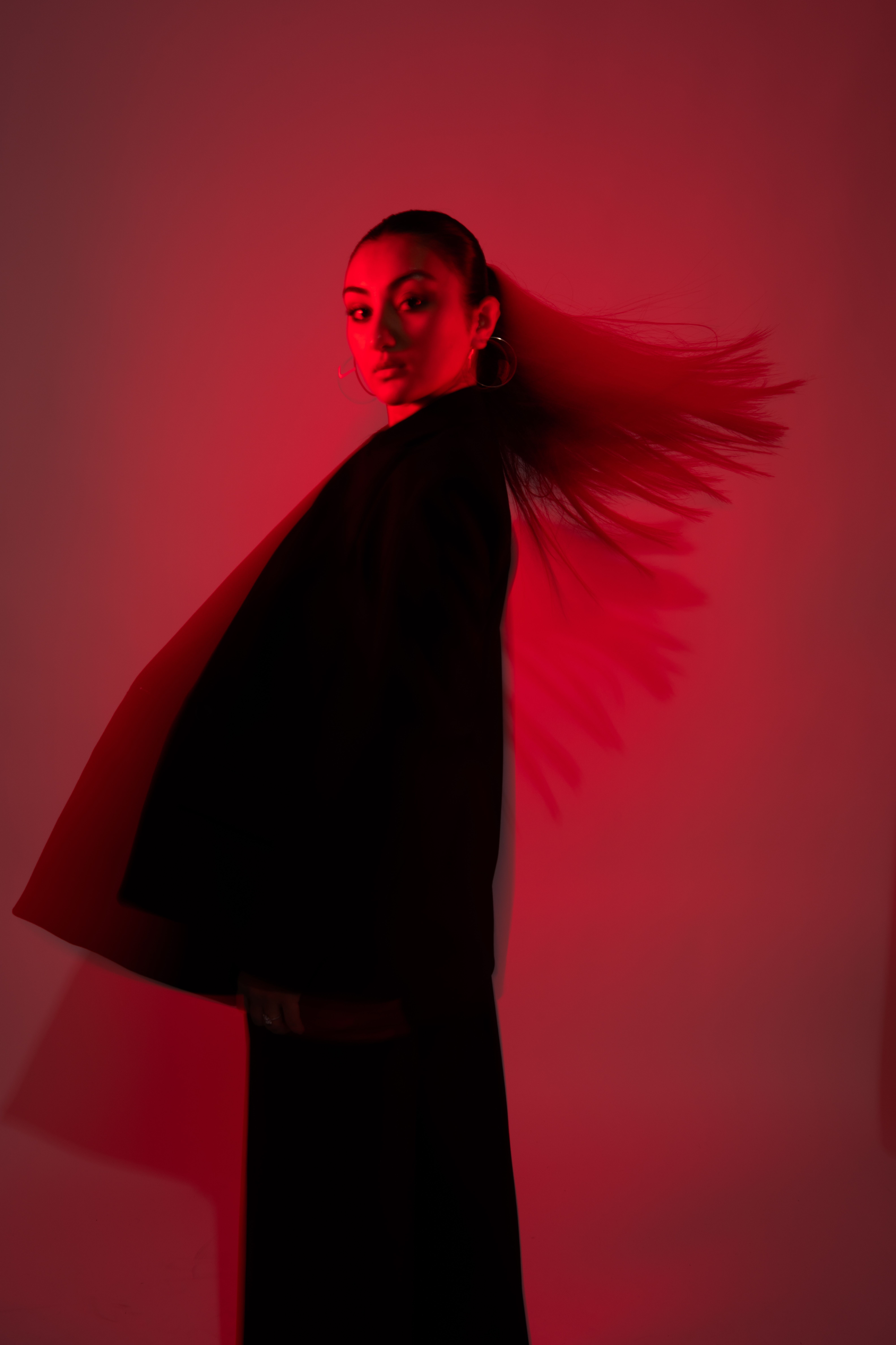 Dynamic Fashion Portrait with Red Lighting · Free Stock Photo