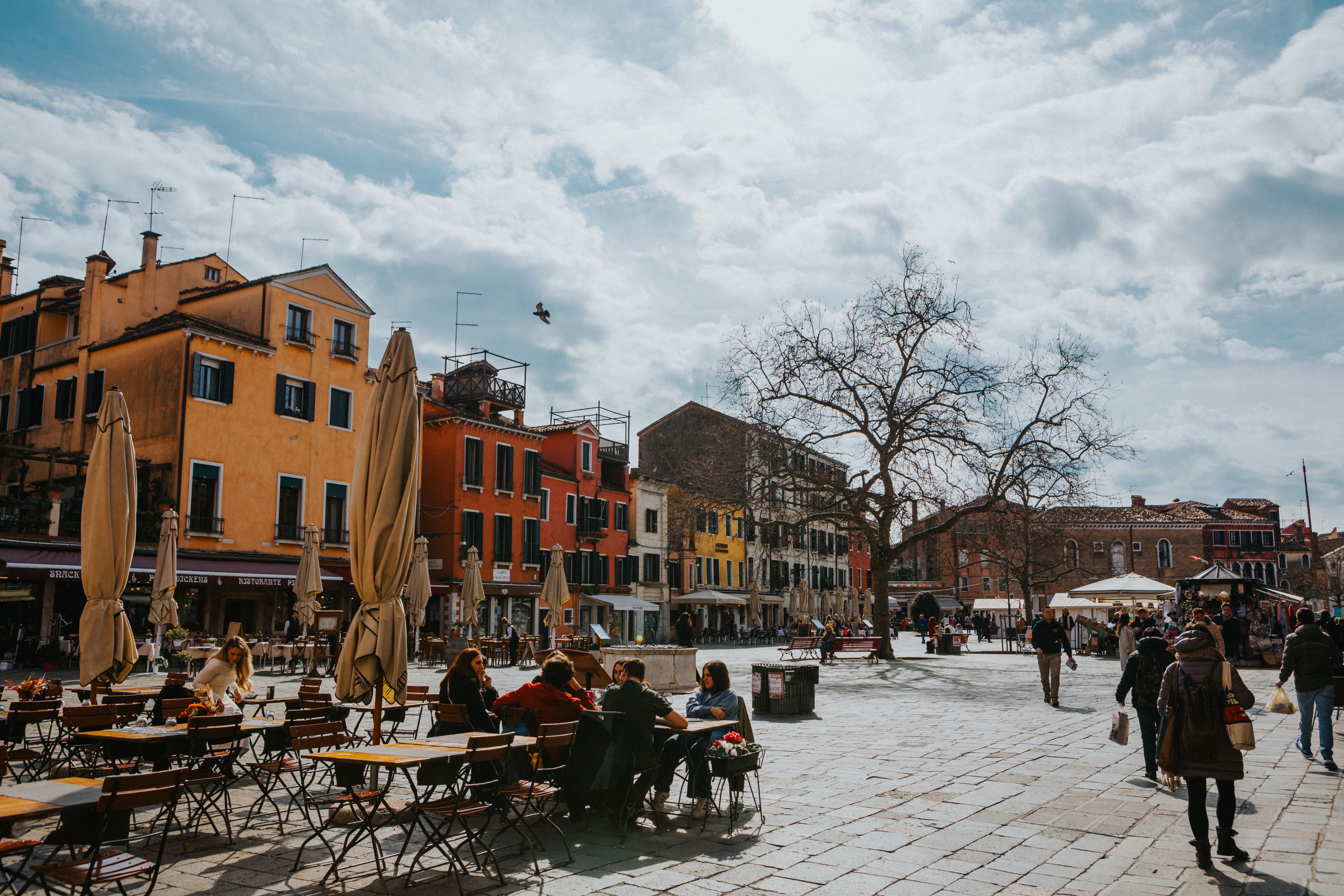 Lively Italian Piazza with Vibrant Architecture · Free Stock Photo