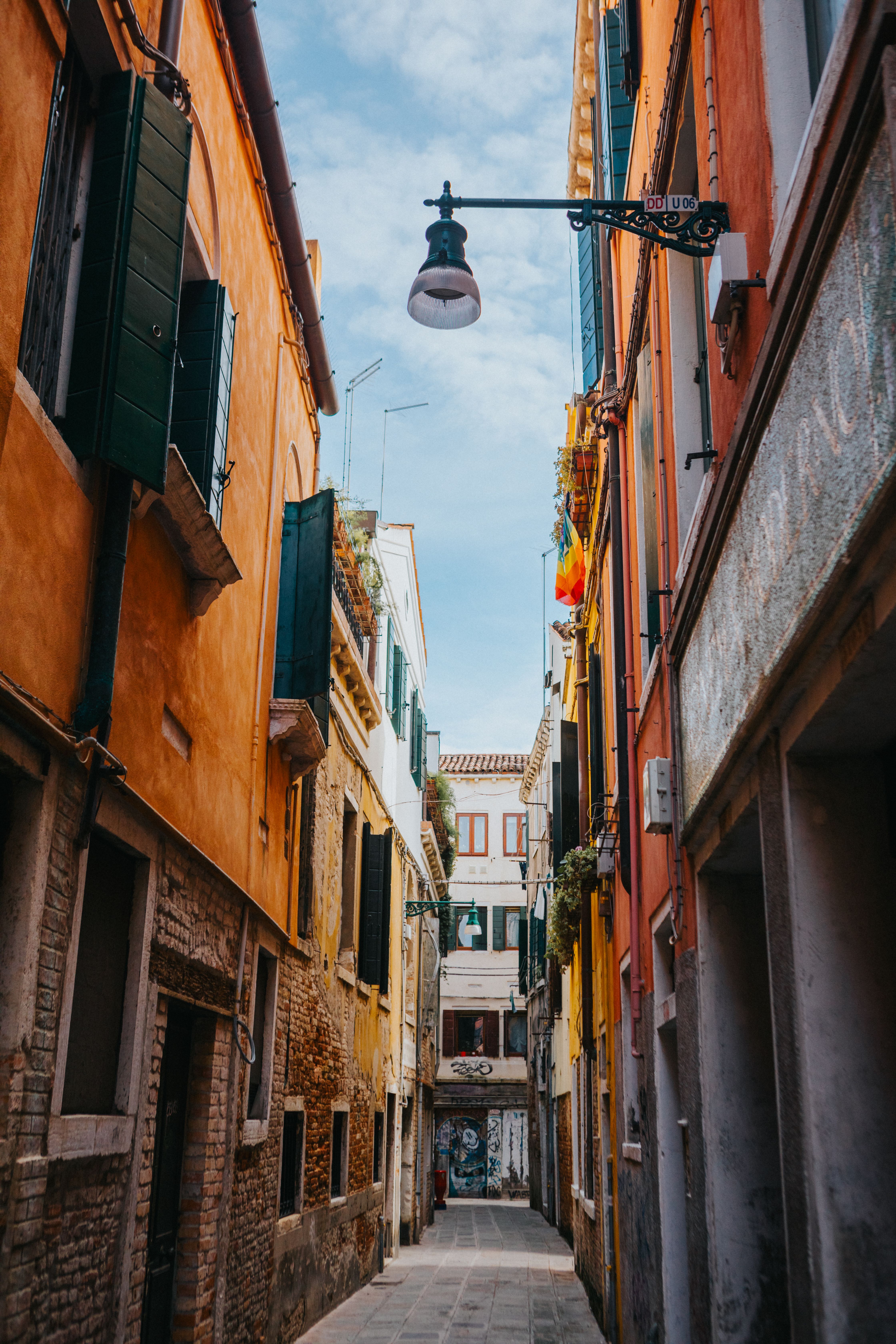 Charming Venetian Alleyway with Vibrant Buildings · Free Stock Photo