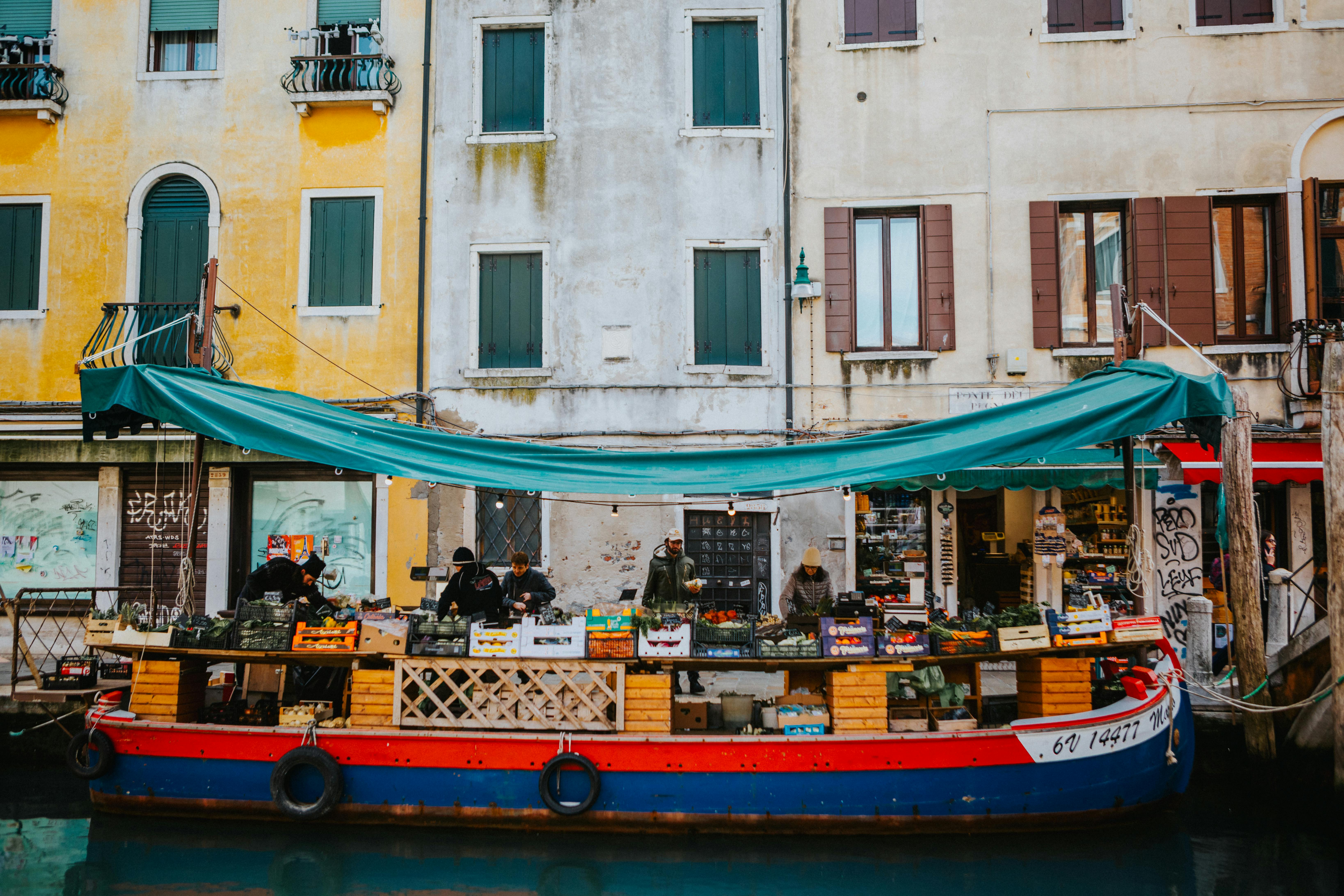Colorful Floating Market Boat in Venice Canal · Free Stock Photo