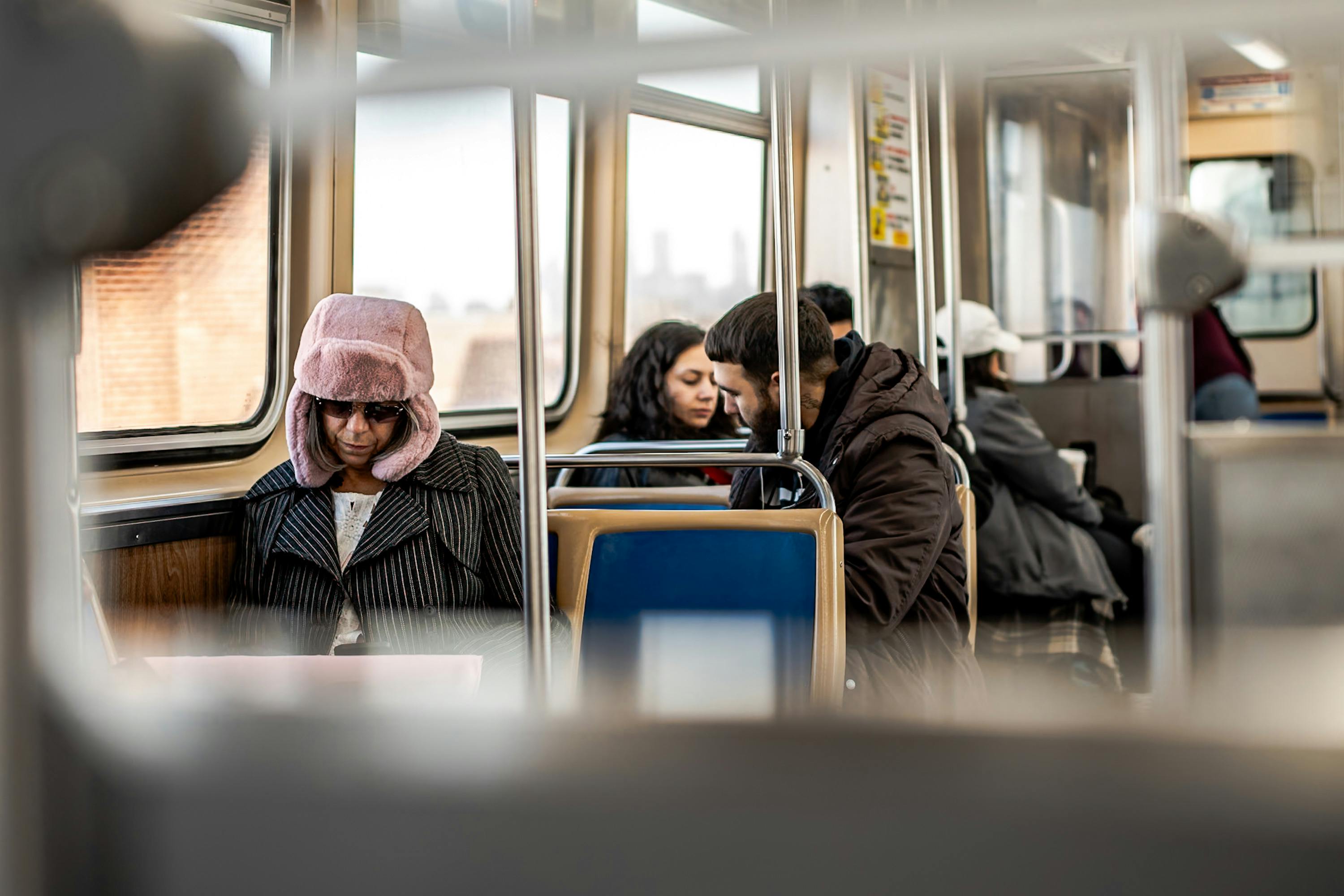 Commuters in Cozy Winter Wear on City Train · Free Stock Photo
