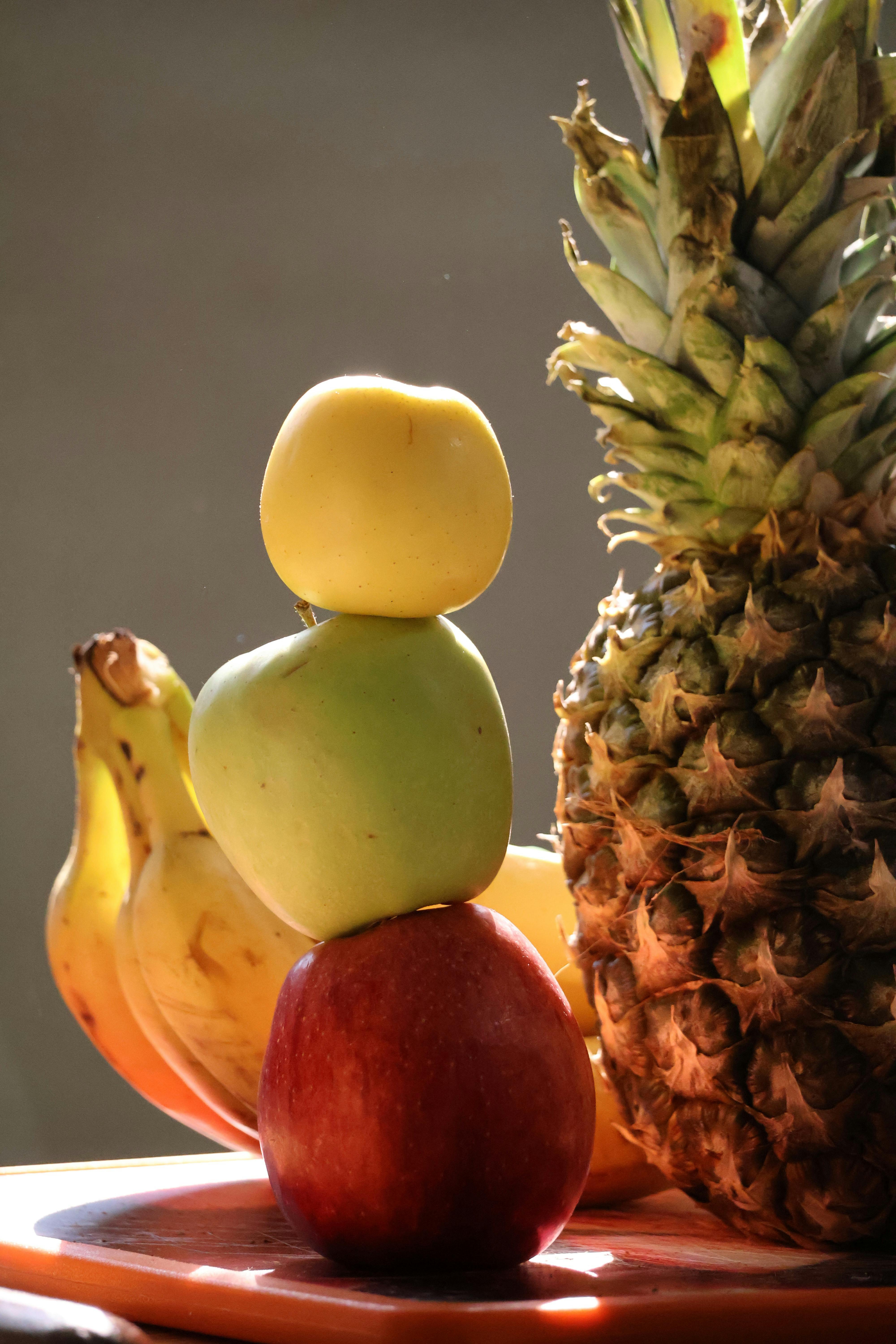 Balanced Fruits Still Life with Pineapple and Apples · Free Stock Photo