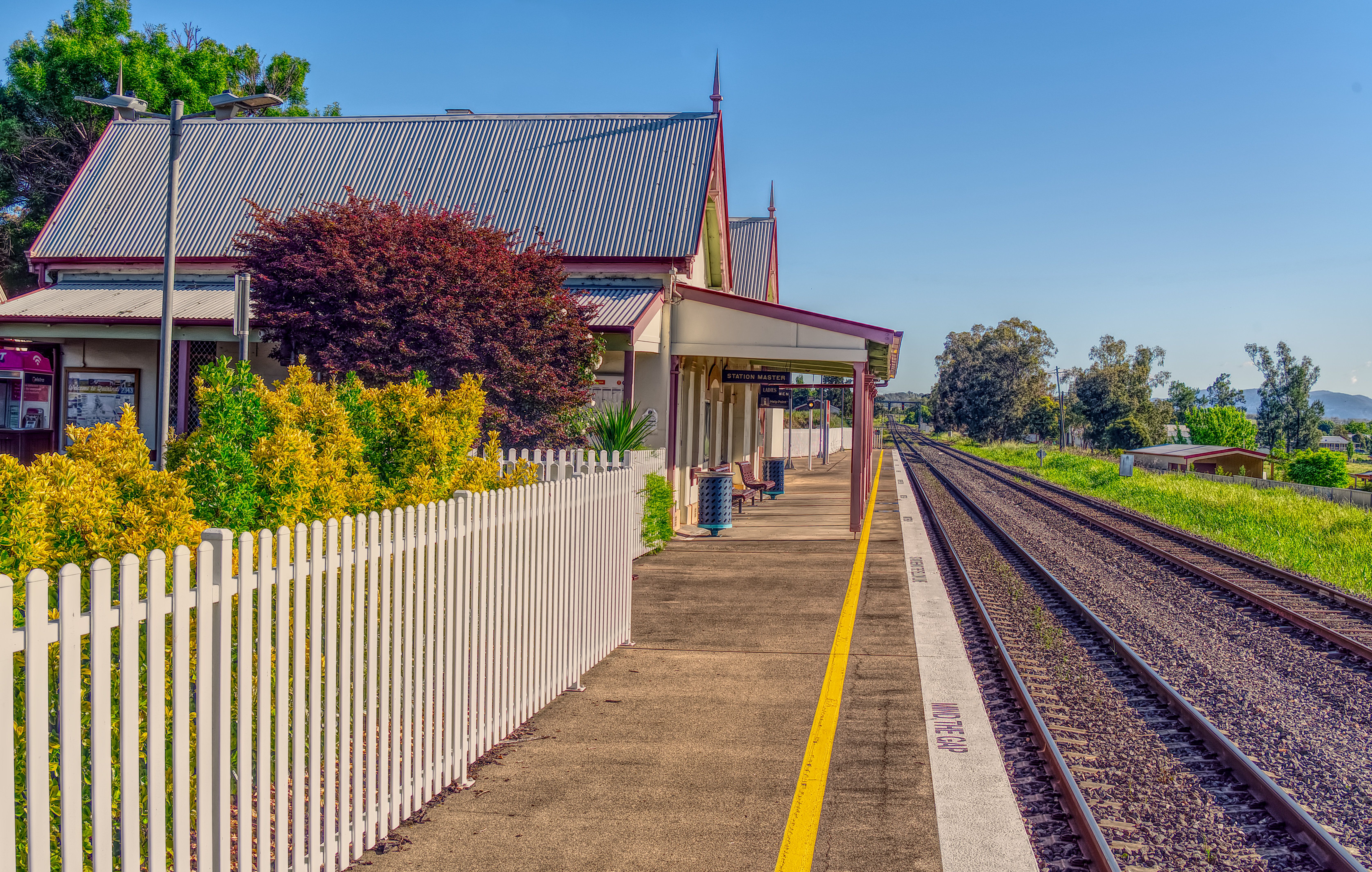 Charming Rural Train Station Platform Scenery · Free Stock Photo