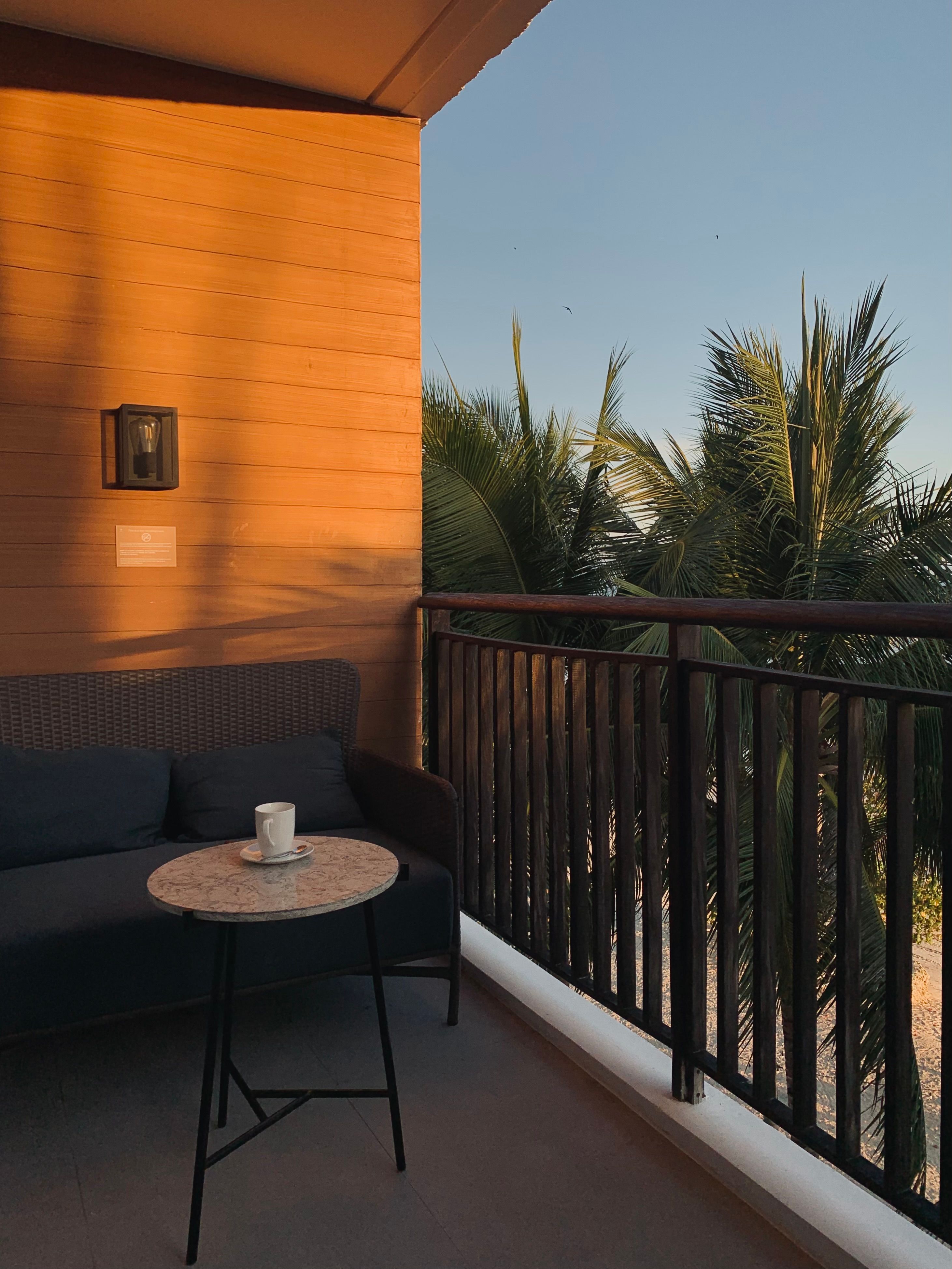 Cozy Balcony with Tropical View at Sunset · Free Stock Photo