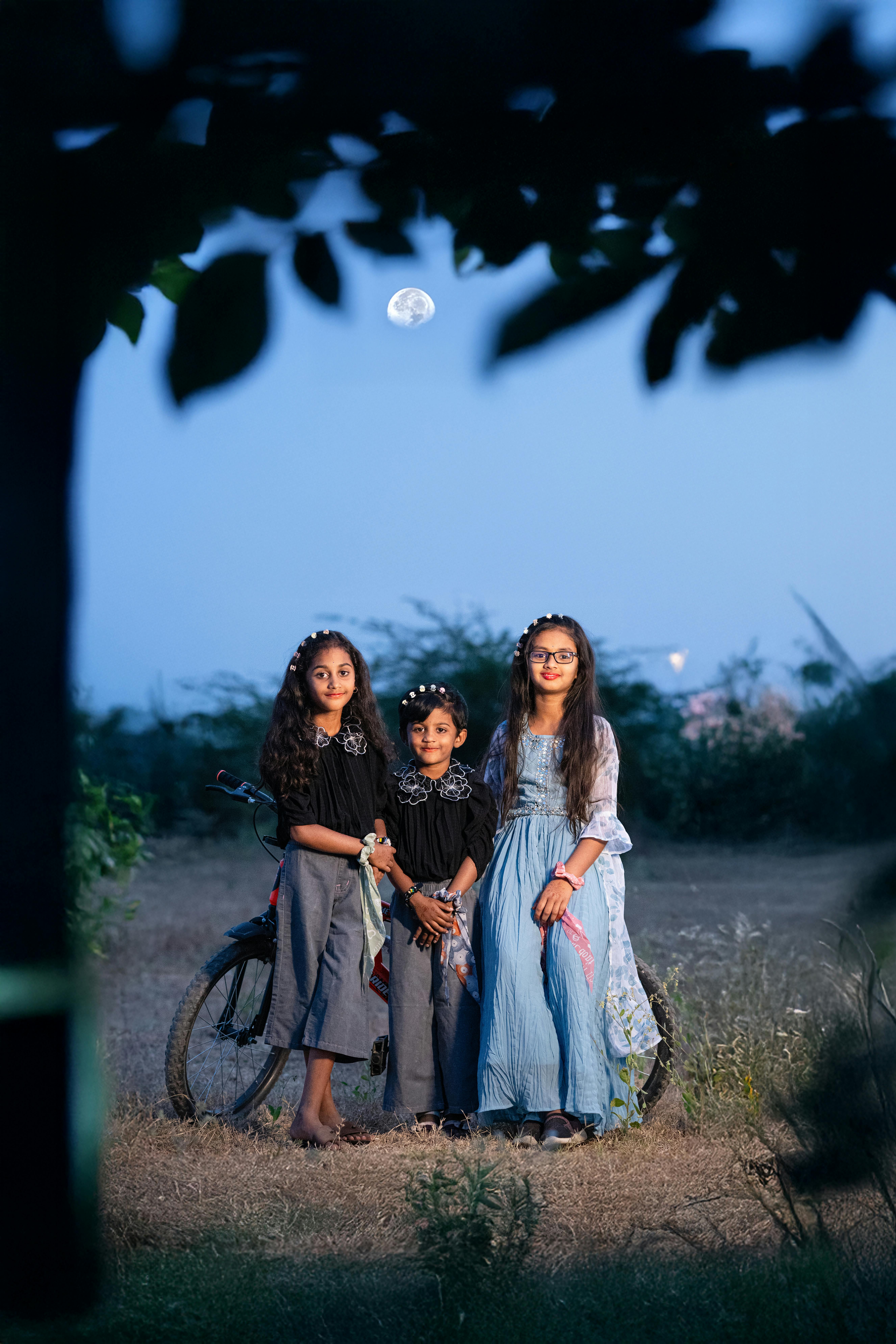 Family Portrait Under Moonlit Sky · Free Stock Photo