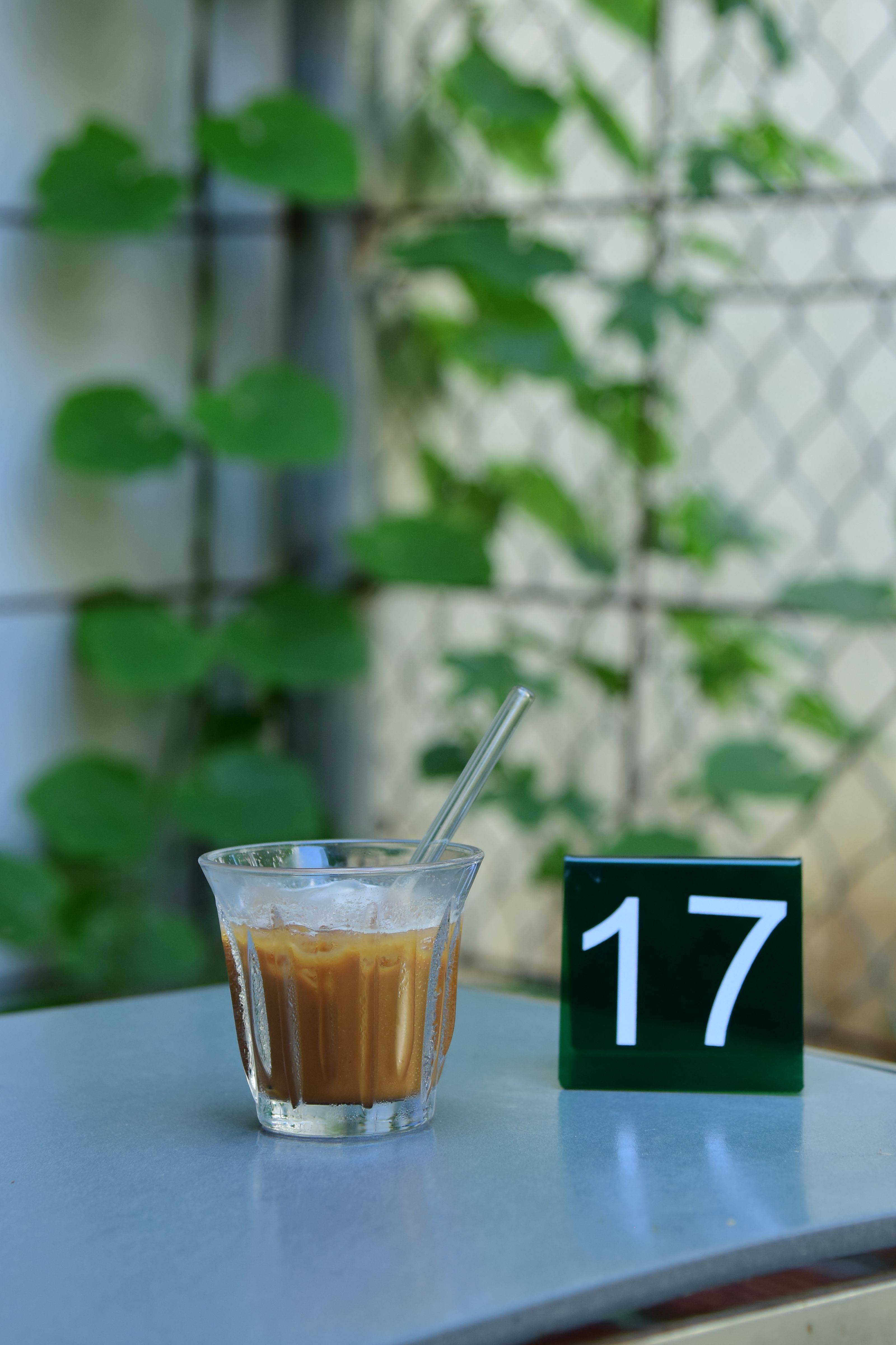 Iced Coffee and Table Number in Outdoor Café · Free Stock Photo