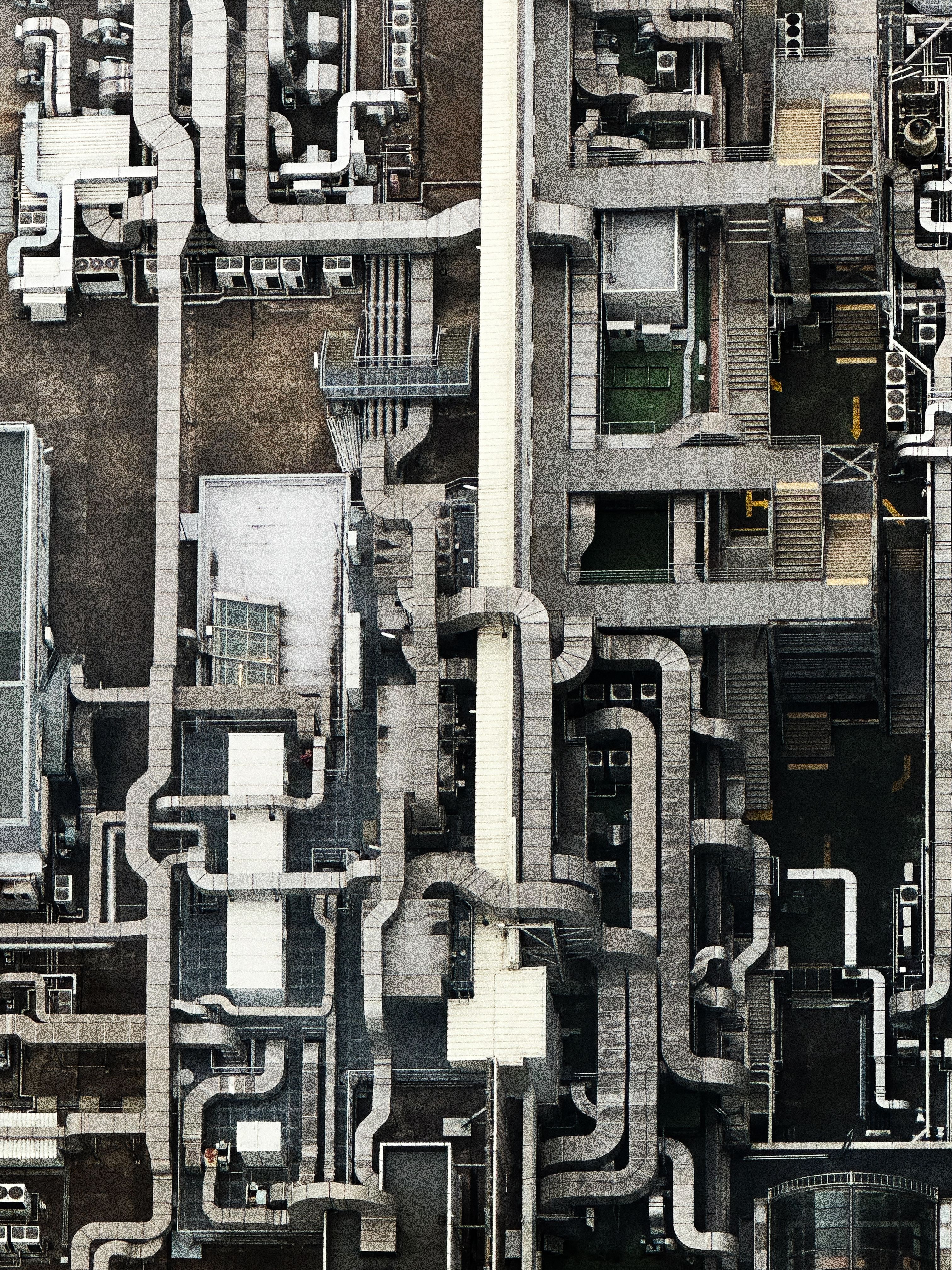 Aerial View of Complex Industrial Pipes · Free Stock Photo