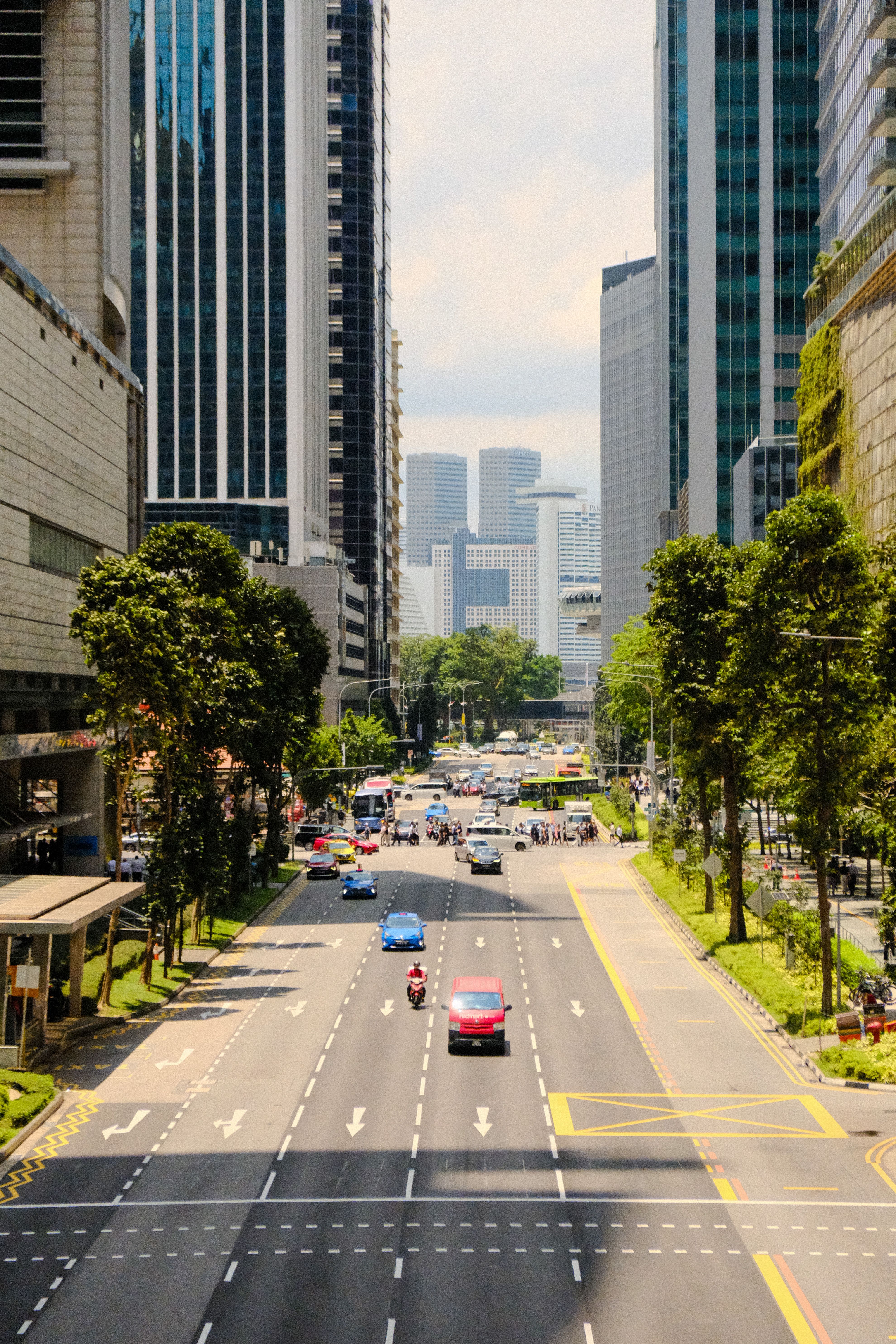 Bustling Urban Street with Skyscrapers and Traffic · Free Stock Photo