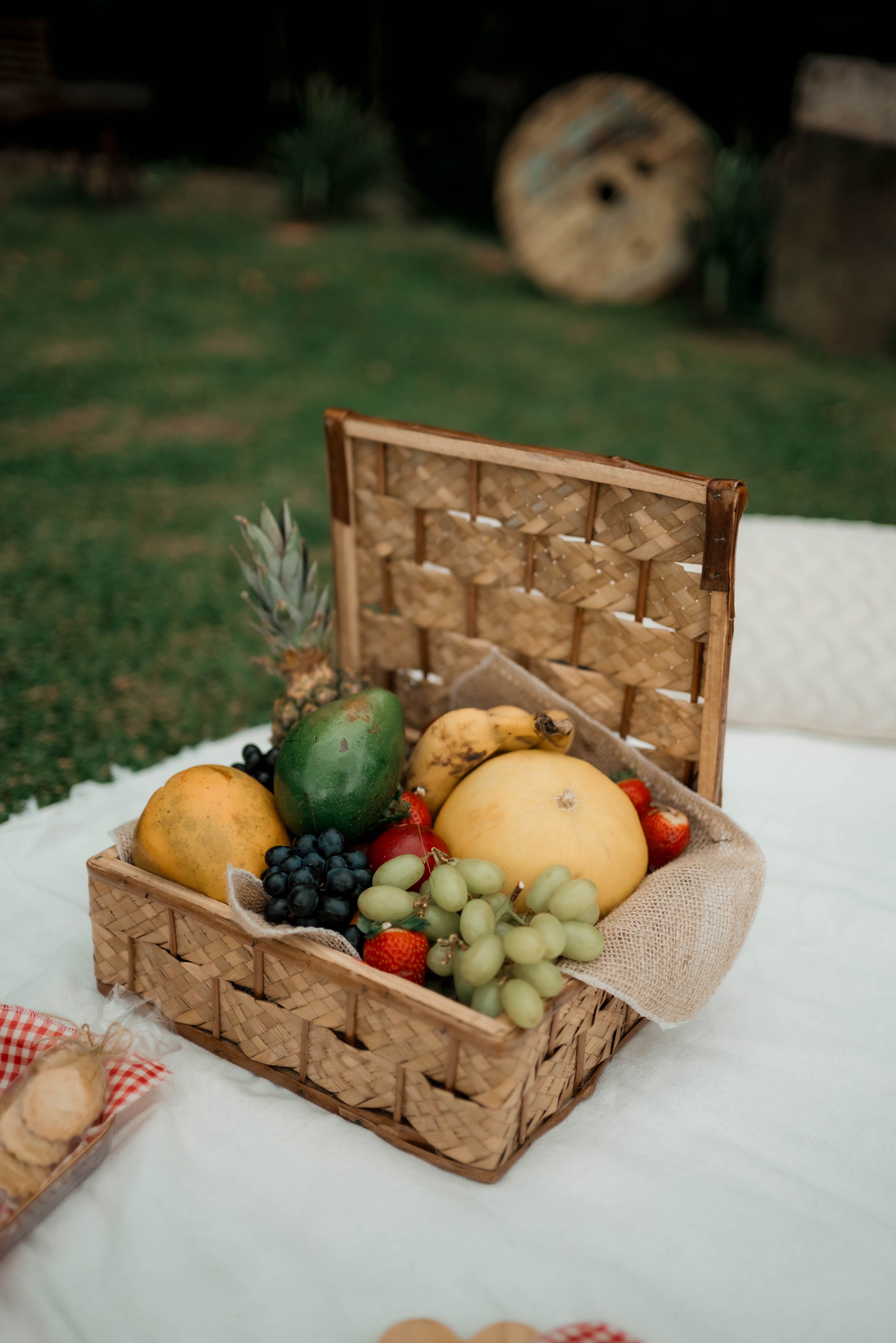 Outdoor Picnic with Fresh Fruit Basket · Free Stock Photo