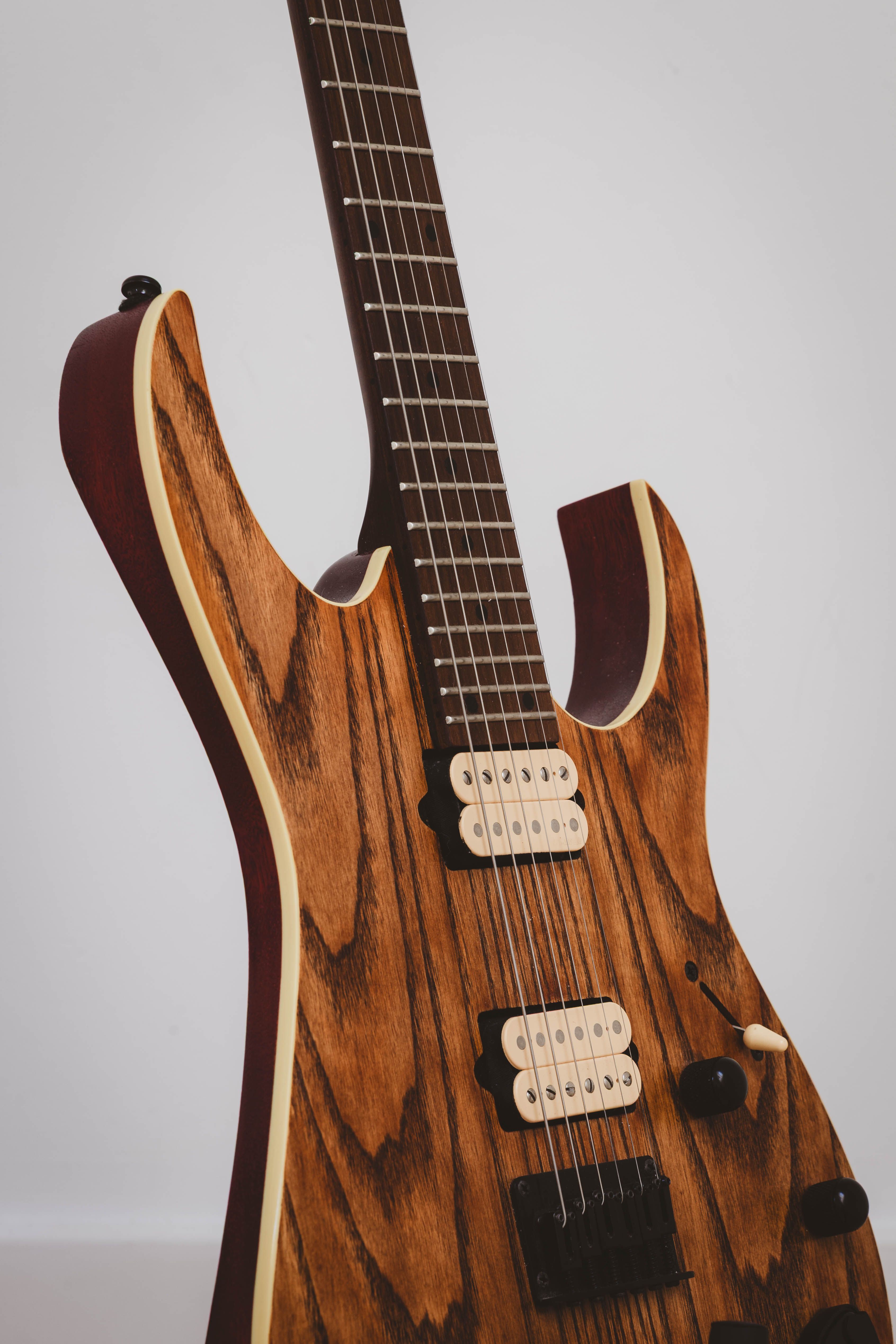 Close-up of a Wooden Electric Guitar Neck and Body · Free Stock Photo