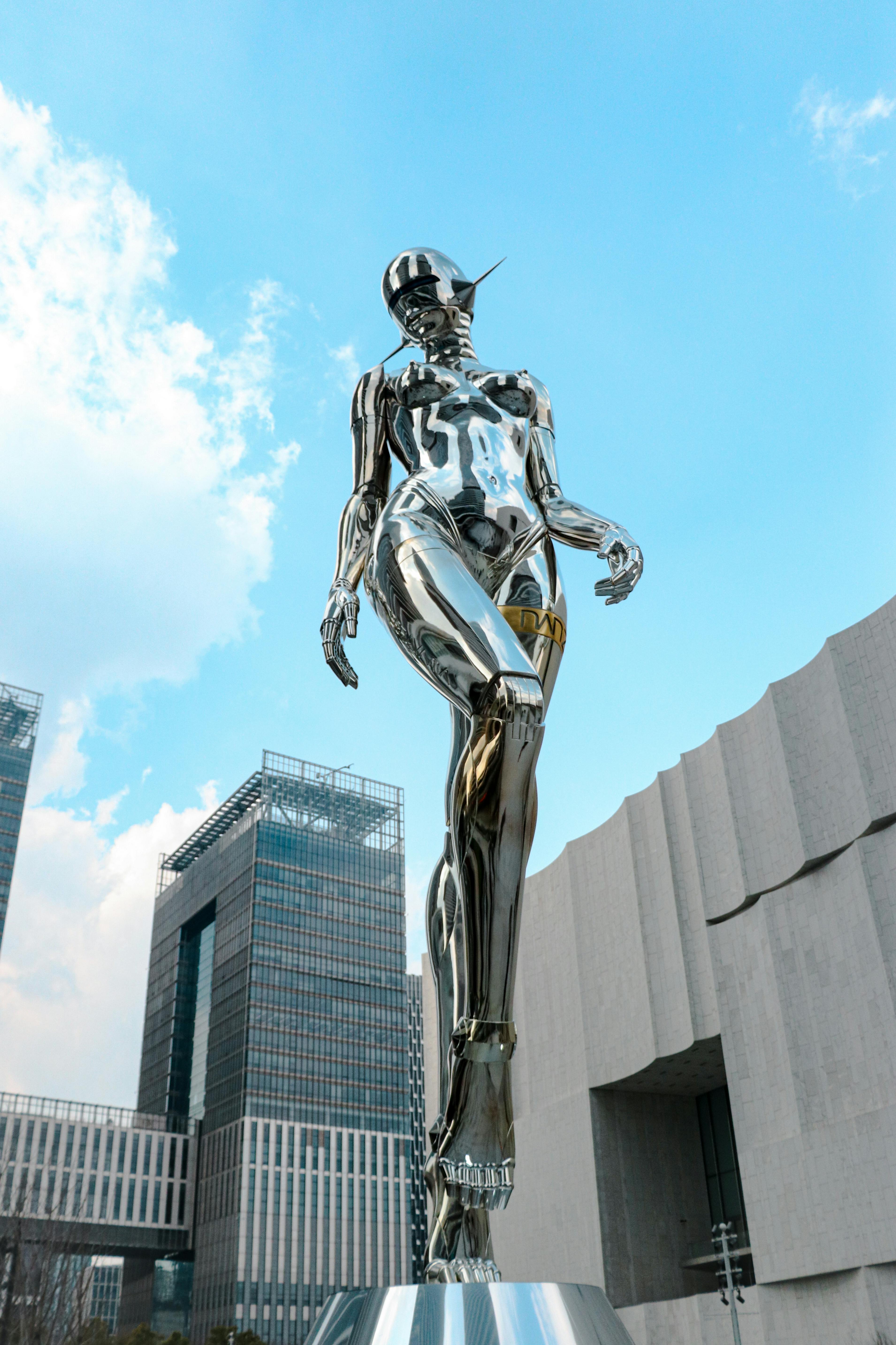 Skyscraper Cityscape with Futuristic Statue · Free Stock Photo