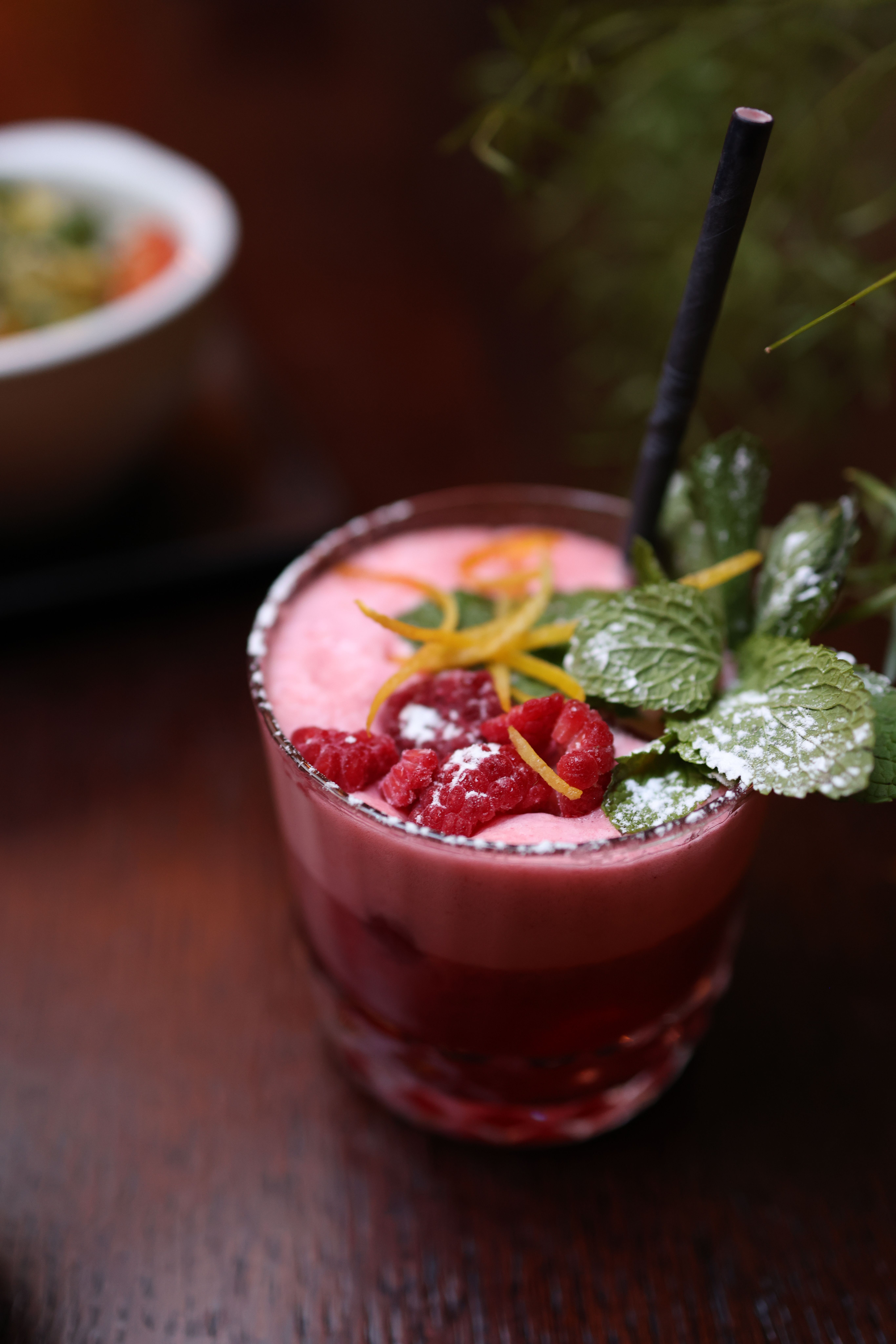 Refreshing Raspberry Mint Cocktail on Wooden Table · Free Stock Photo