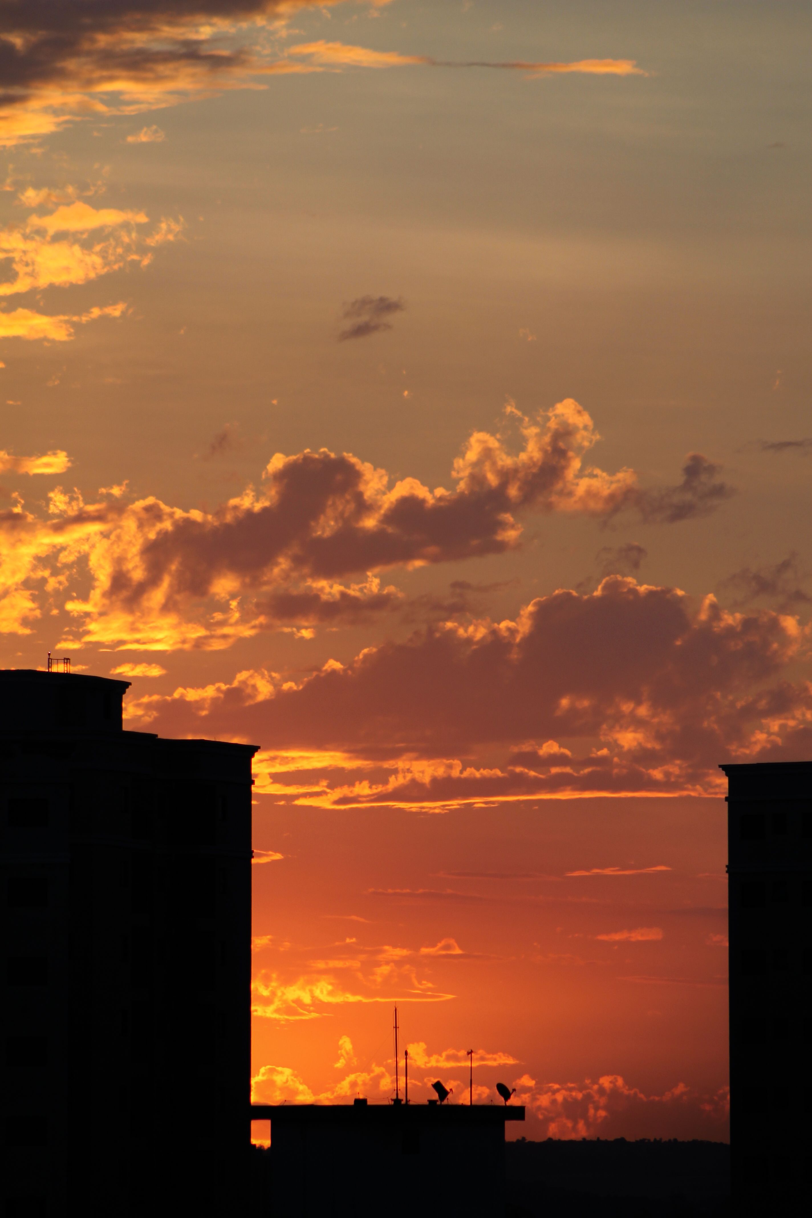 Vibrant Urban Sunset with Silhouetted Buildings · Free Stock Photo