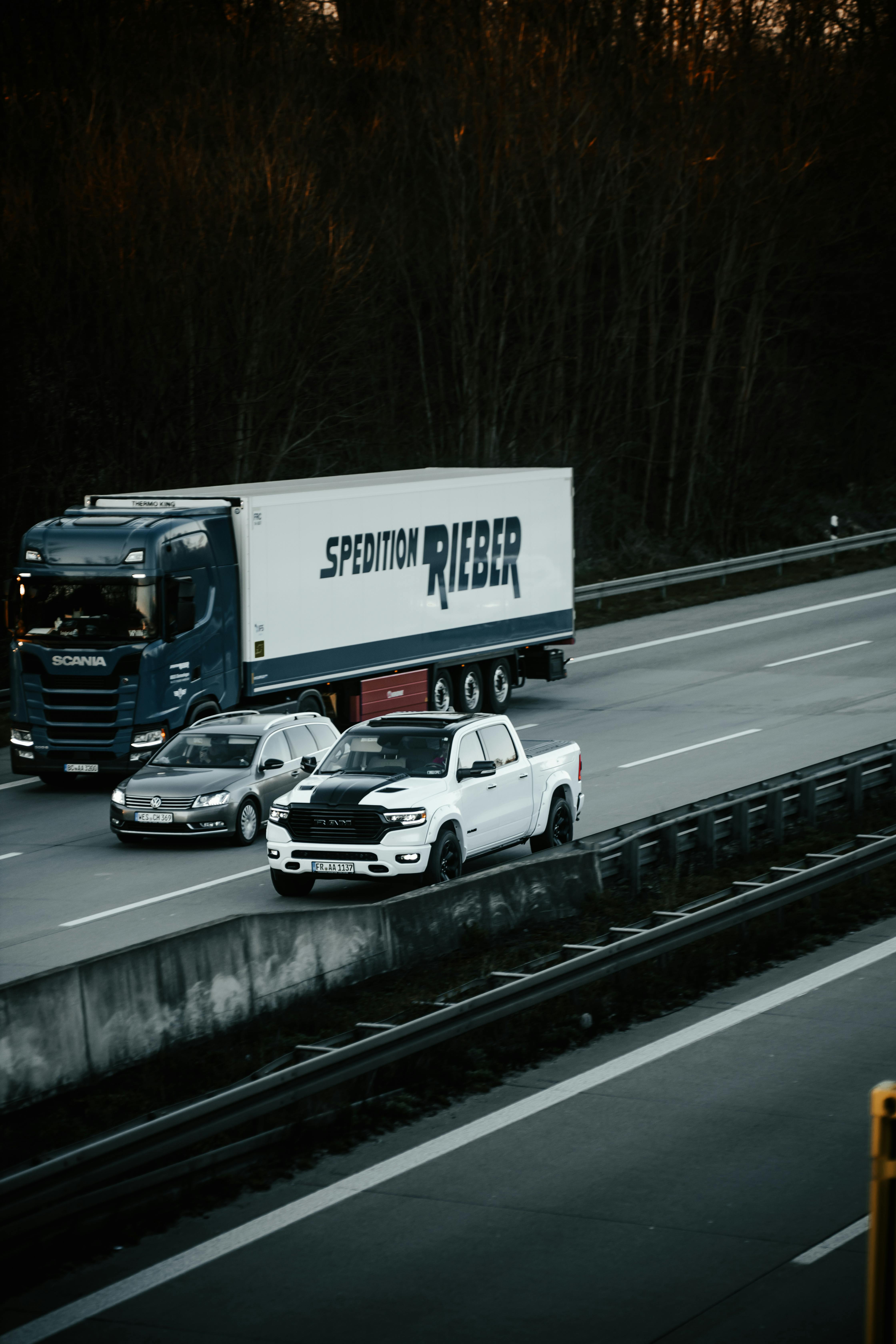 Dynamic Highway Scene with Trucks and Cars · Free Stock Photo