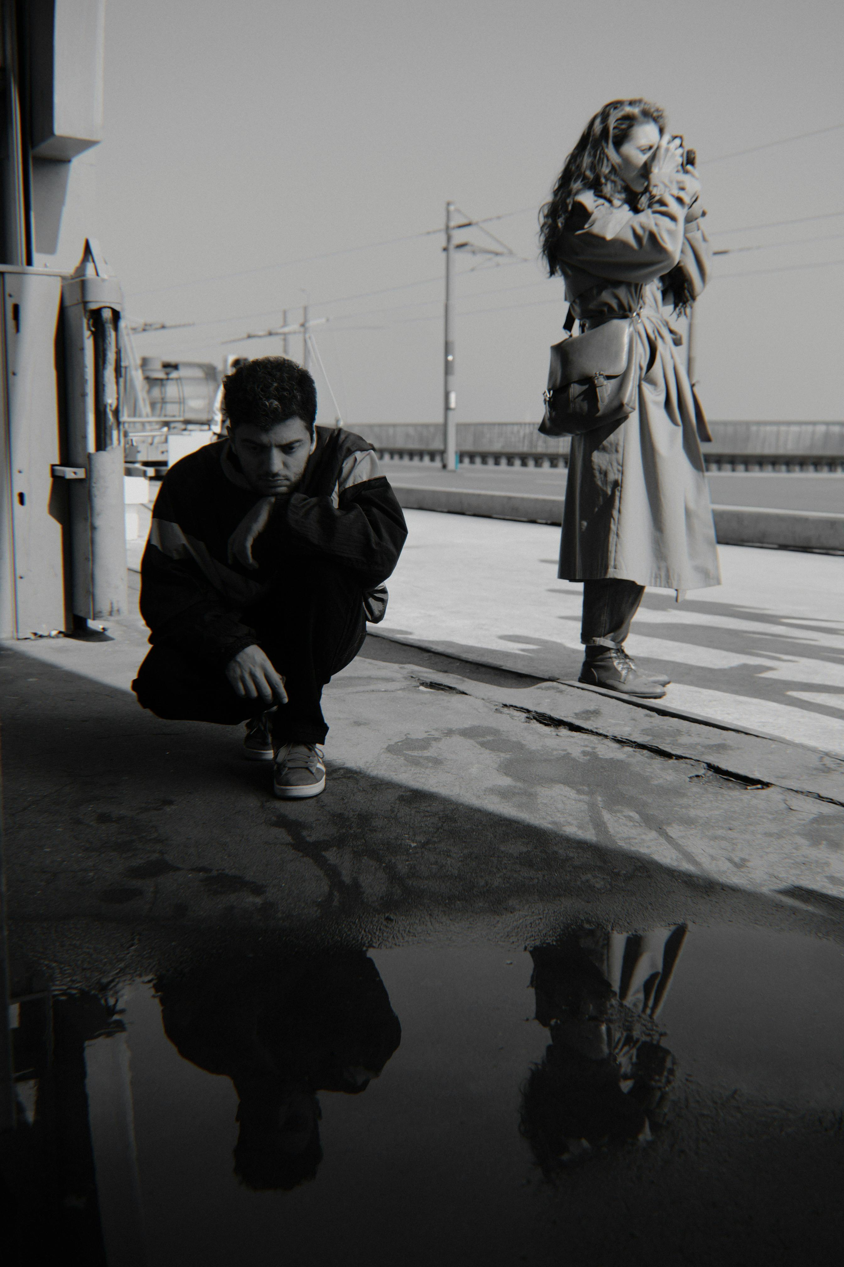 Contemplative Urban Scene with Reflections · Free Stock Photo