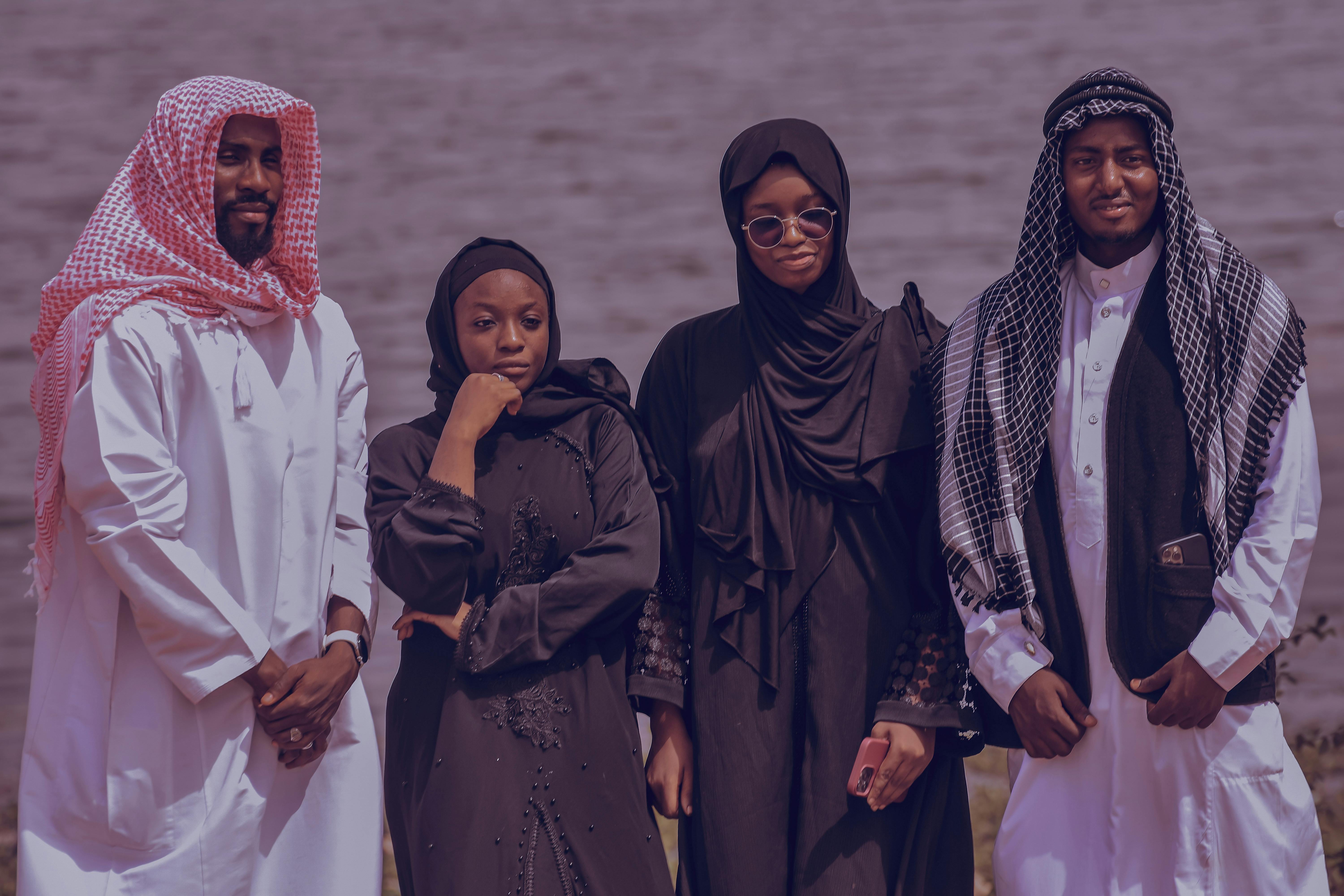 Traditional Middle Eastern Attire by the Water · Free Stock Photo