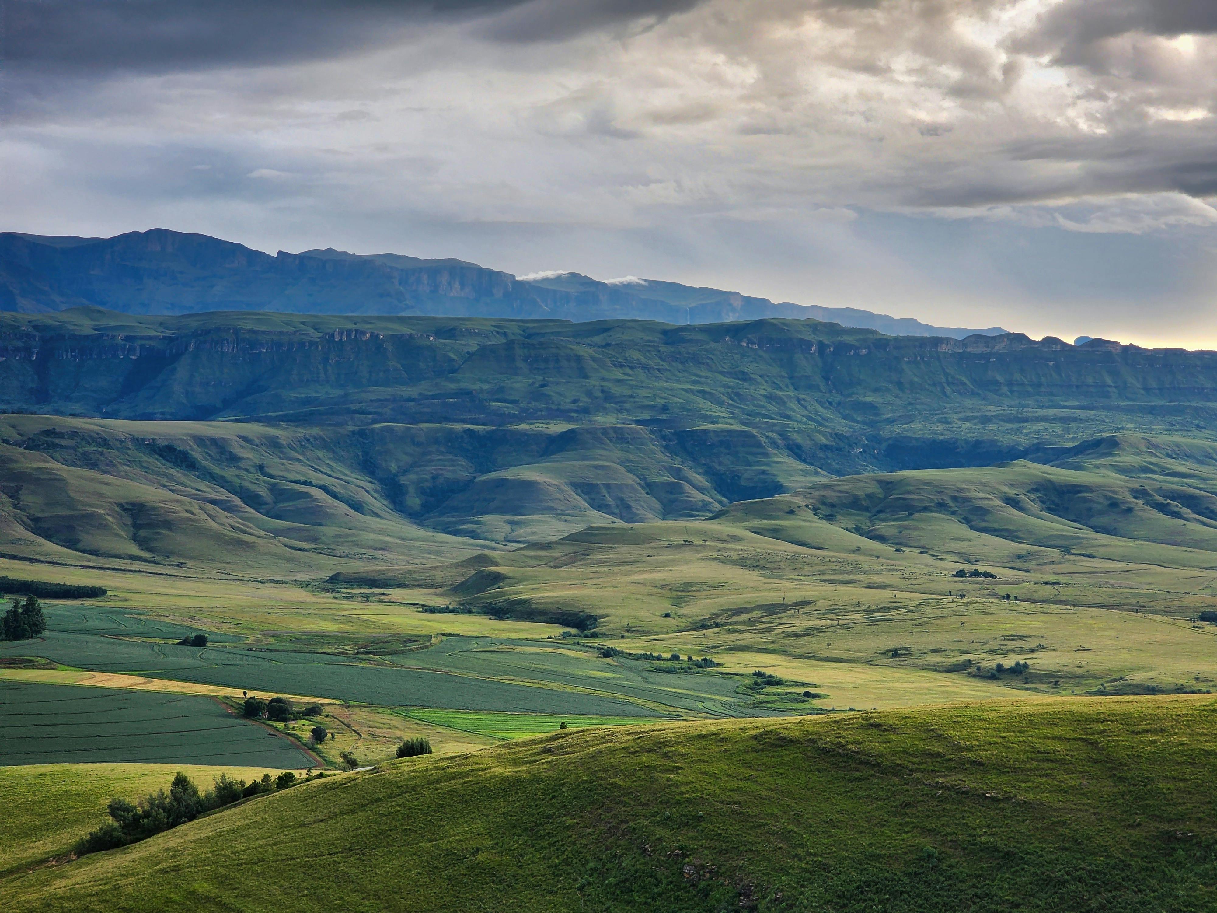 Scenic View of Drakensberg Mountains Under Cloudy Sky · Free Stock Photo