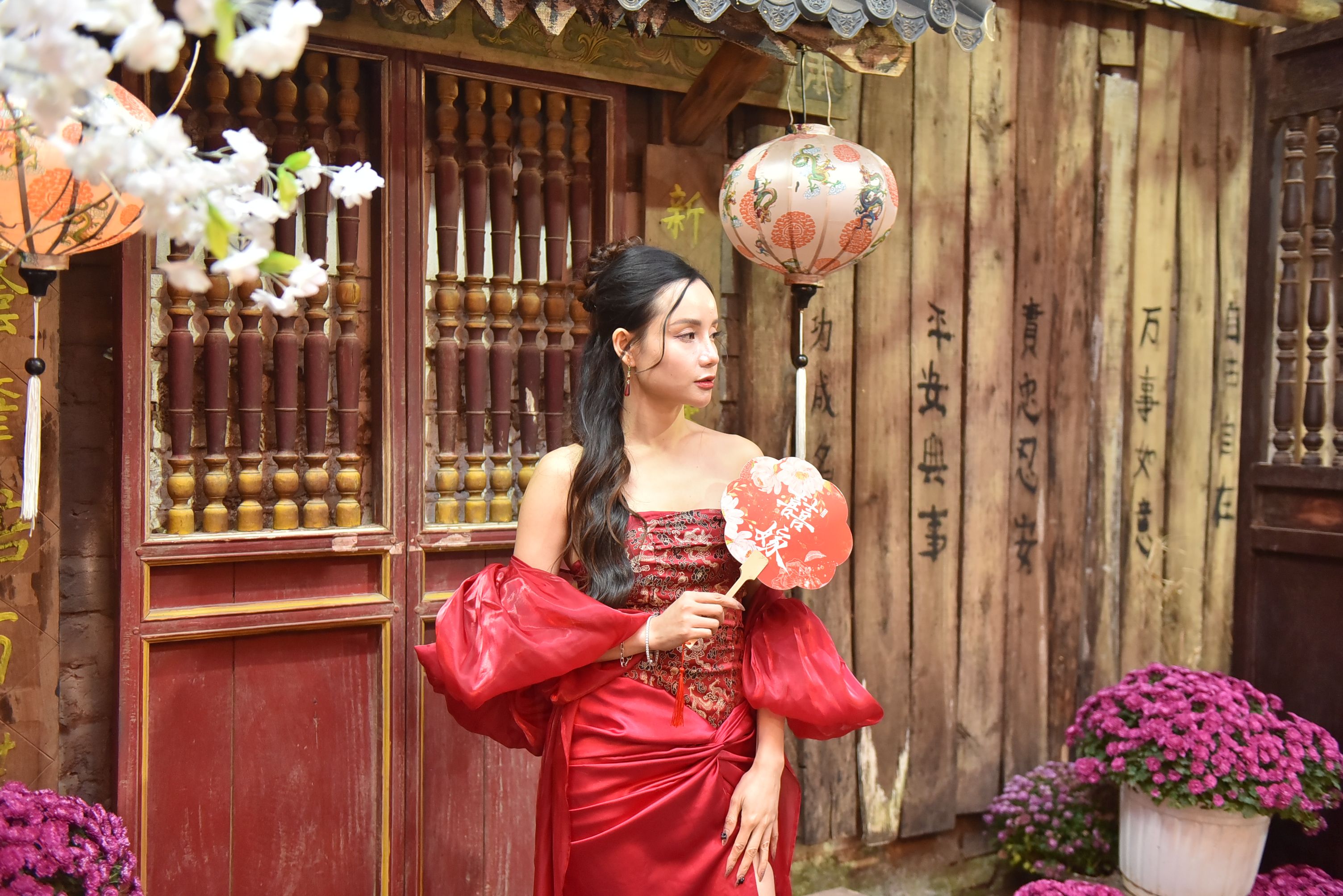 Elegant Woman in Traditional Red Dress with Lanterns · Free Stock Photo