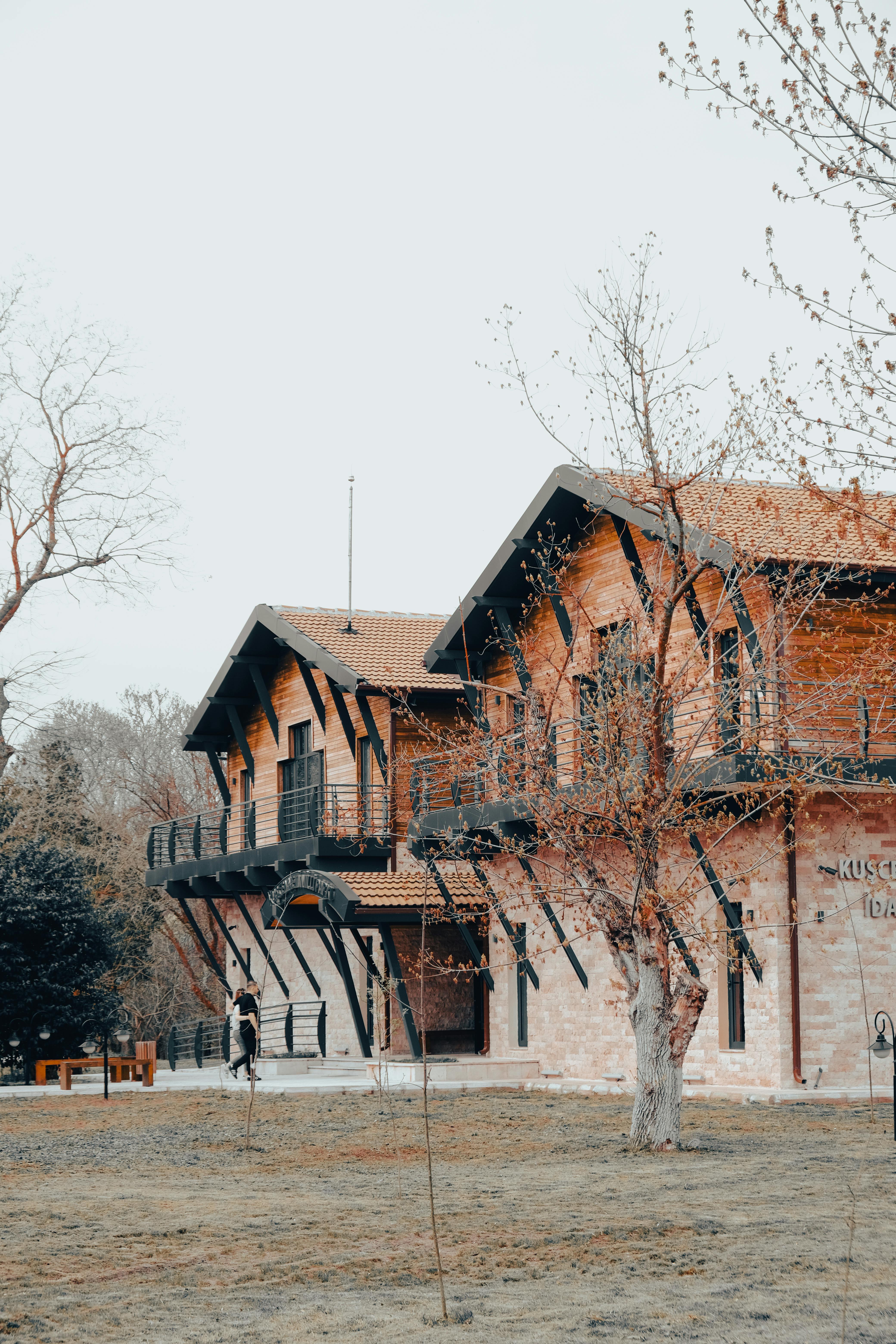 Rustic Wooden Building in Tranquil Setting · Free Stock Photo