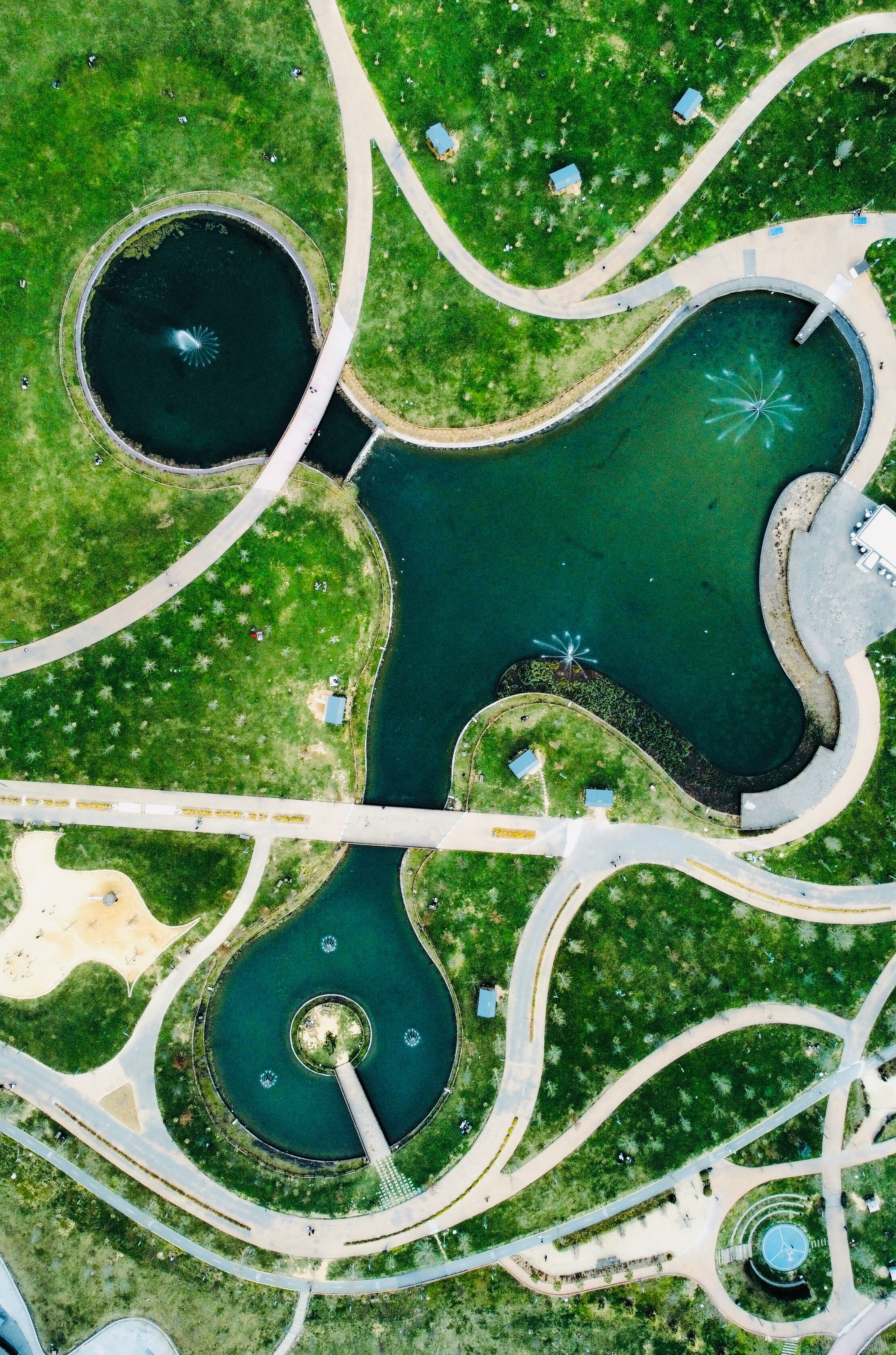 Aerial View of a Modern Public Park with Ponds · Free Stock Photo