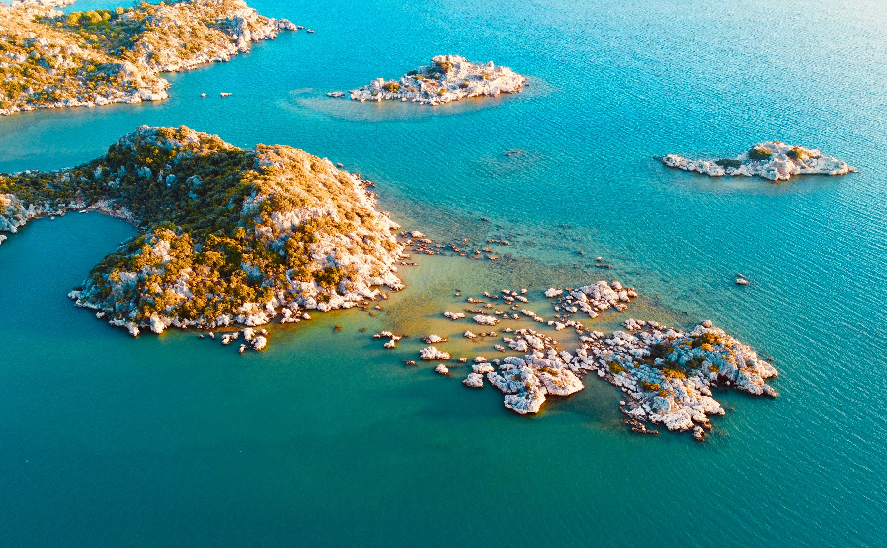 Aerial View of Rocky Islands in Azure Sea · Free Stock Photo