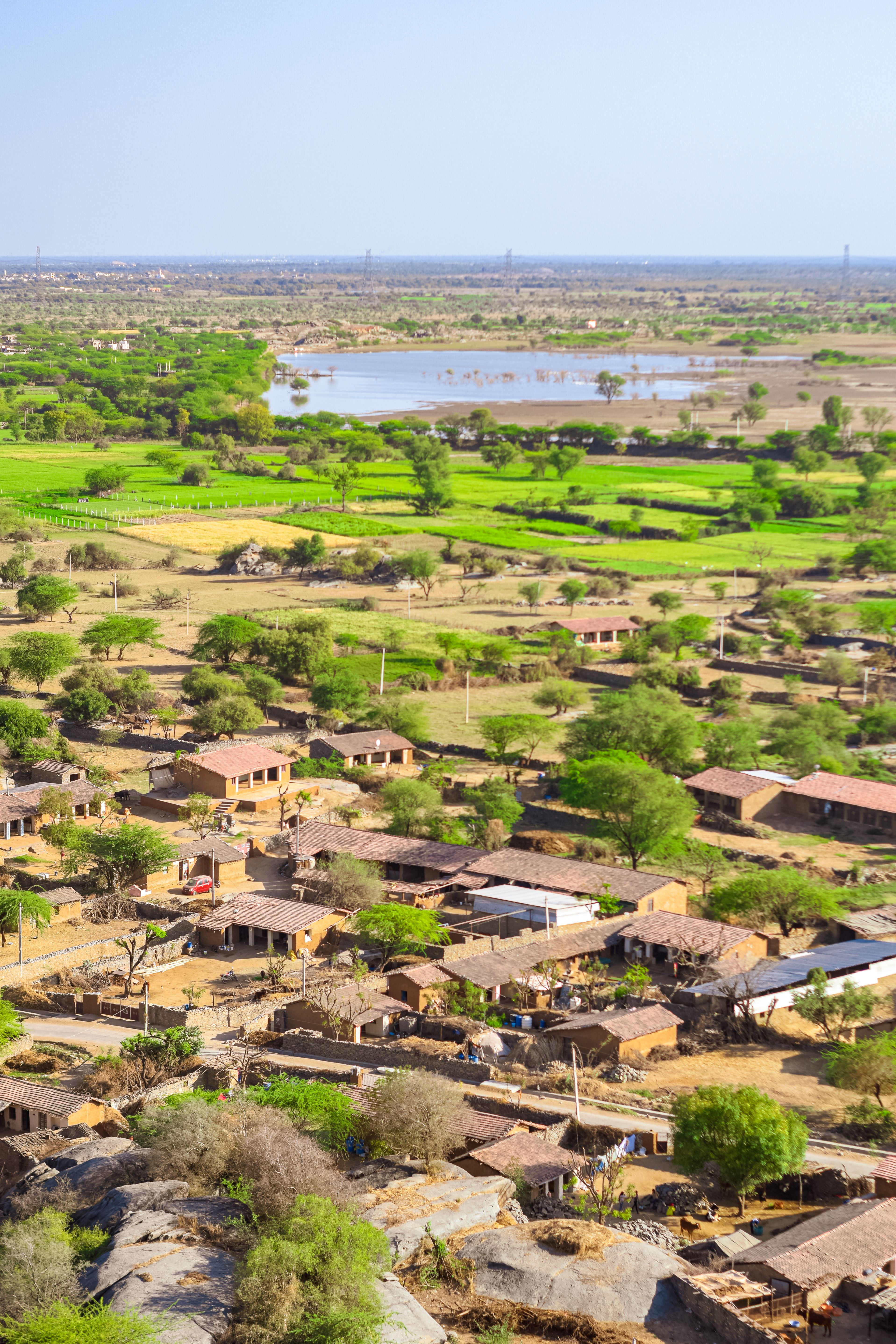 Aerial View of Rural Landscape with Fields and Houses · Free Stock Photo