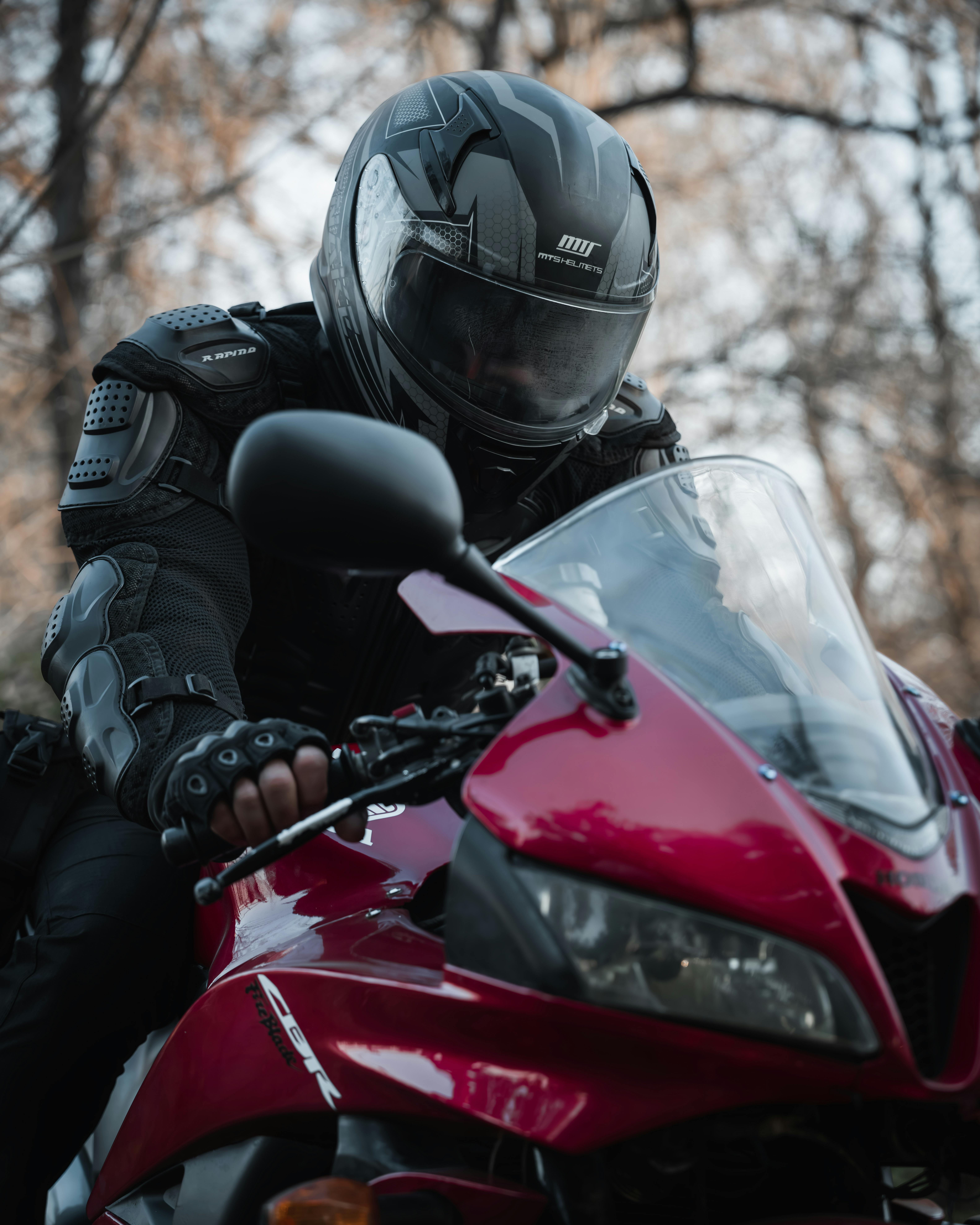 Motorcyclist in Full Gear Riding Red Sport Bike · Free Stock Photo