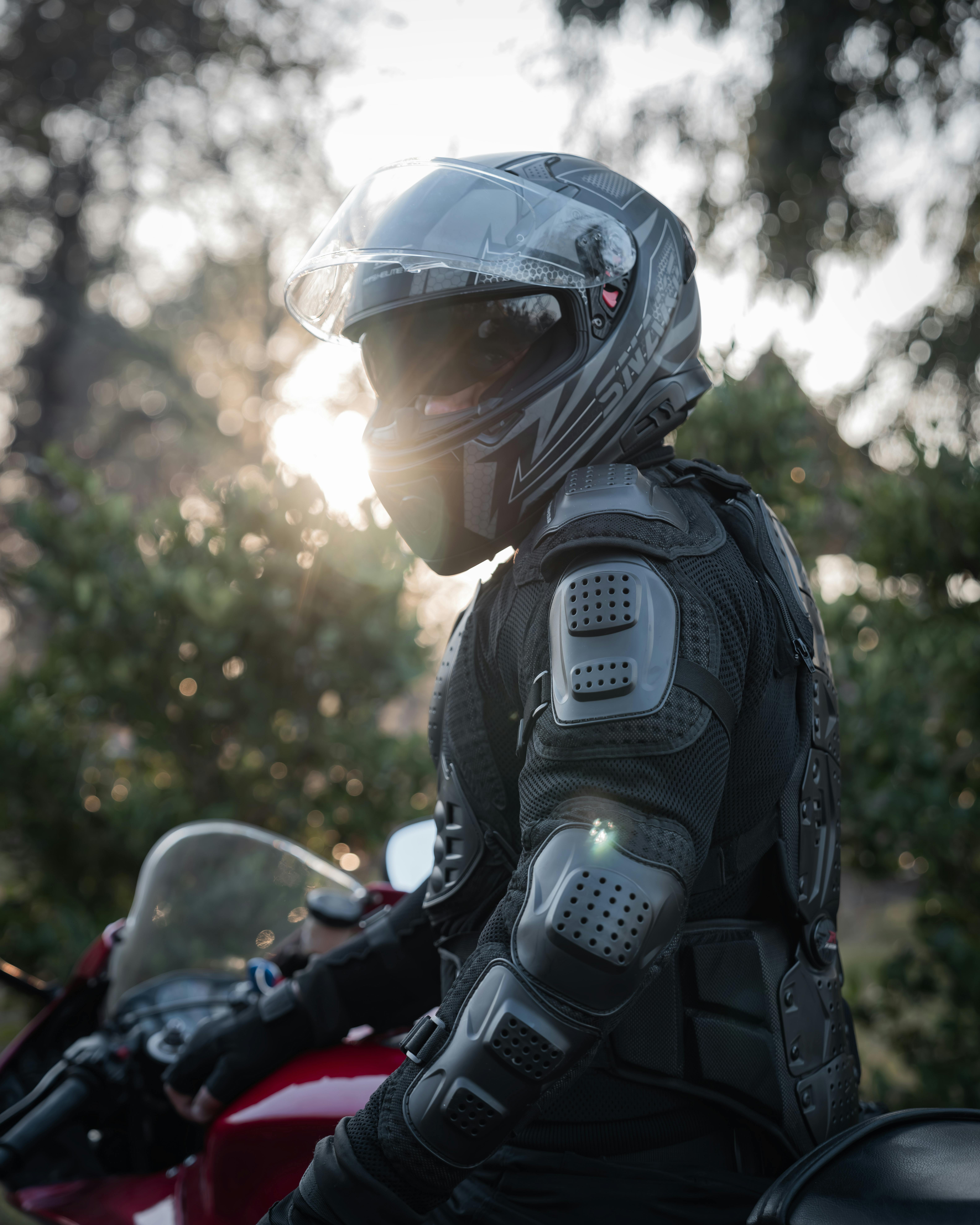 Motorcyclist in Gear at Sunset Outdoors · Free Stock Photo