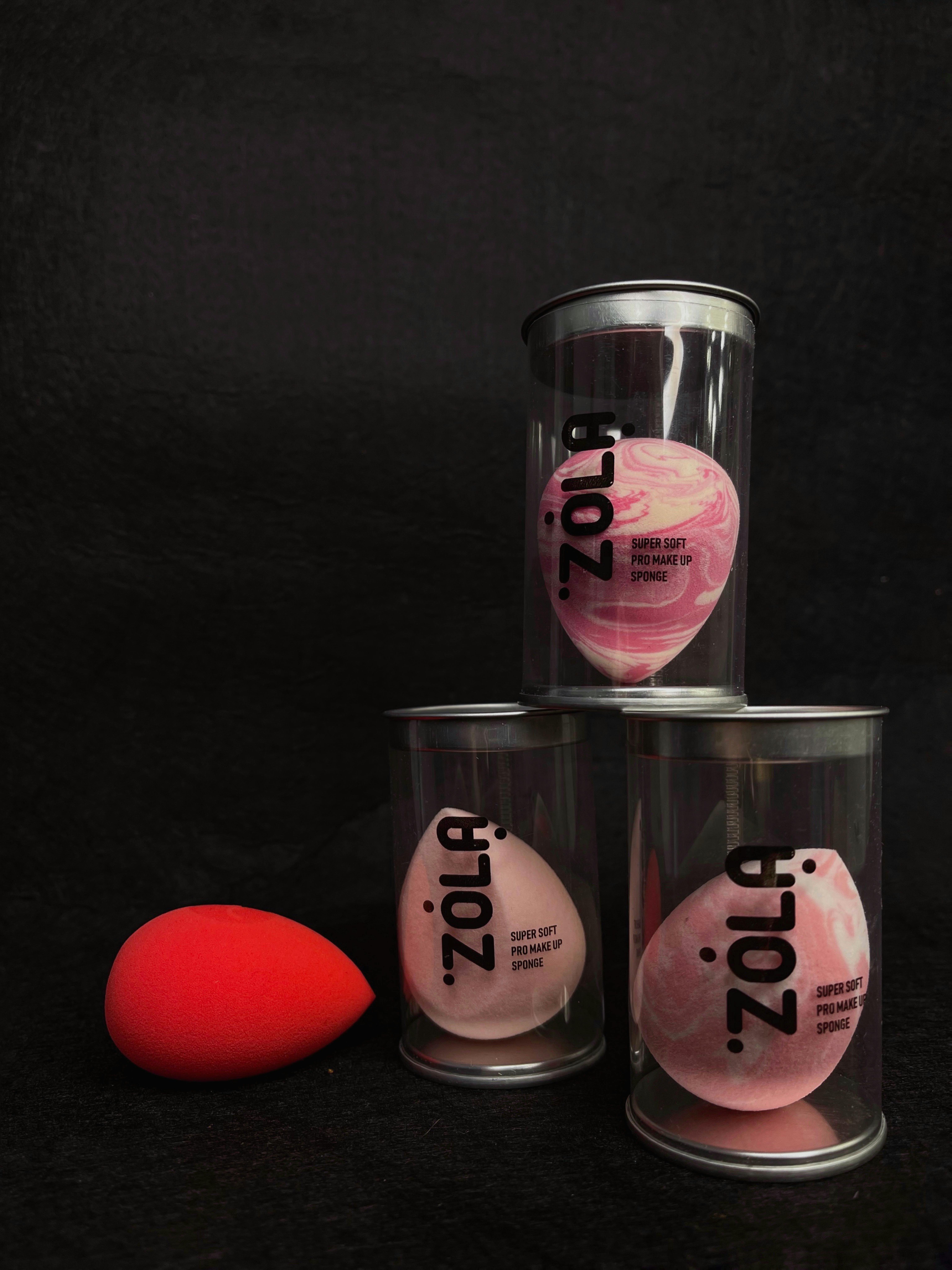 Colorful Cosmetic Sponges on Black Background · Free Stock Photo