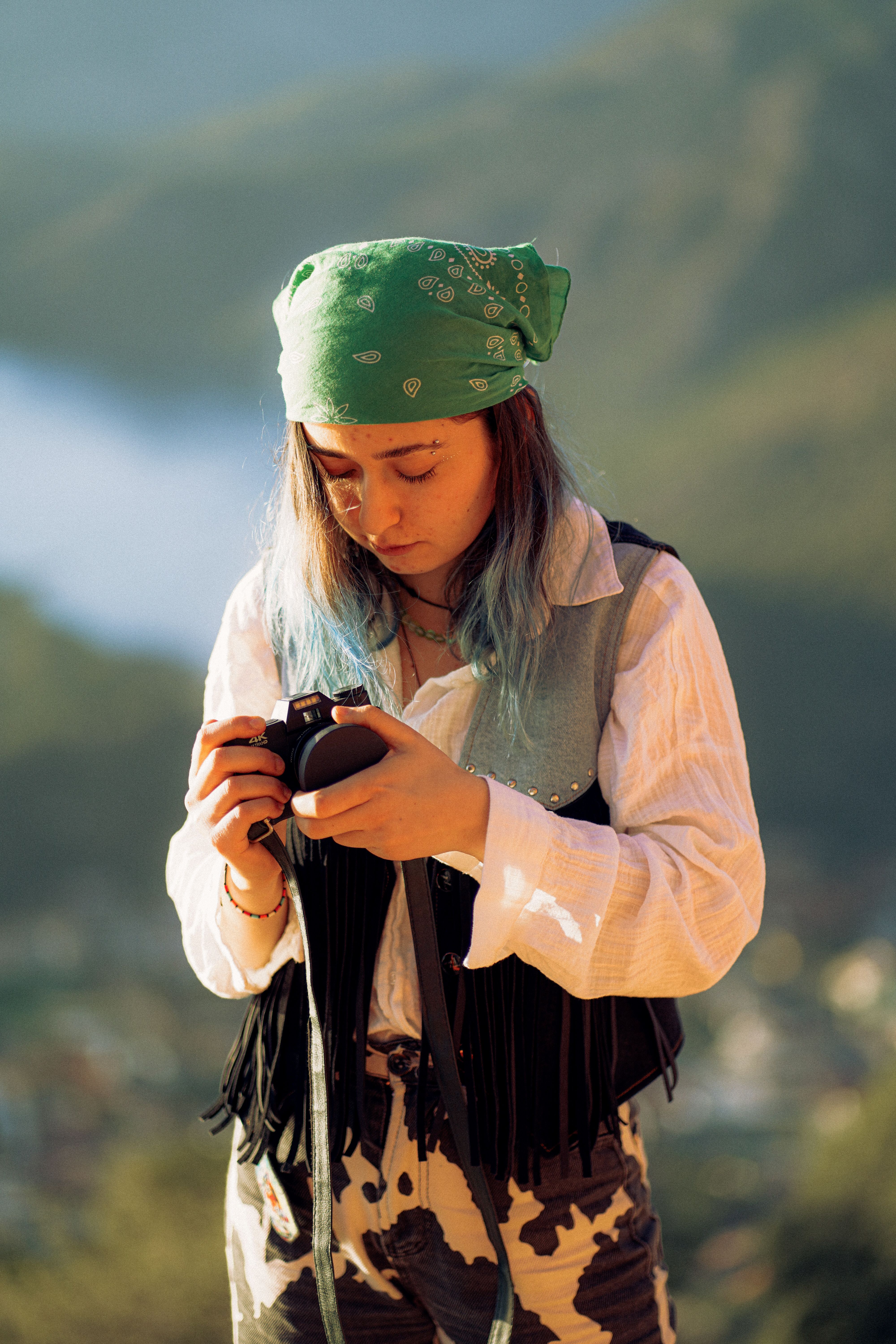 Young Woman Exploring Outdoors with Camera · Free Stock Photo
