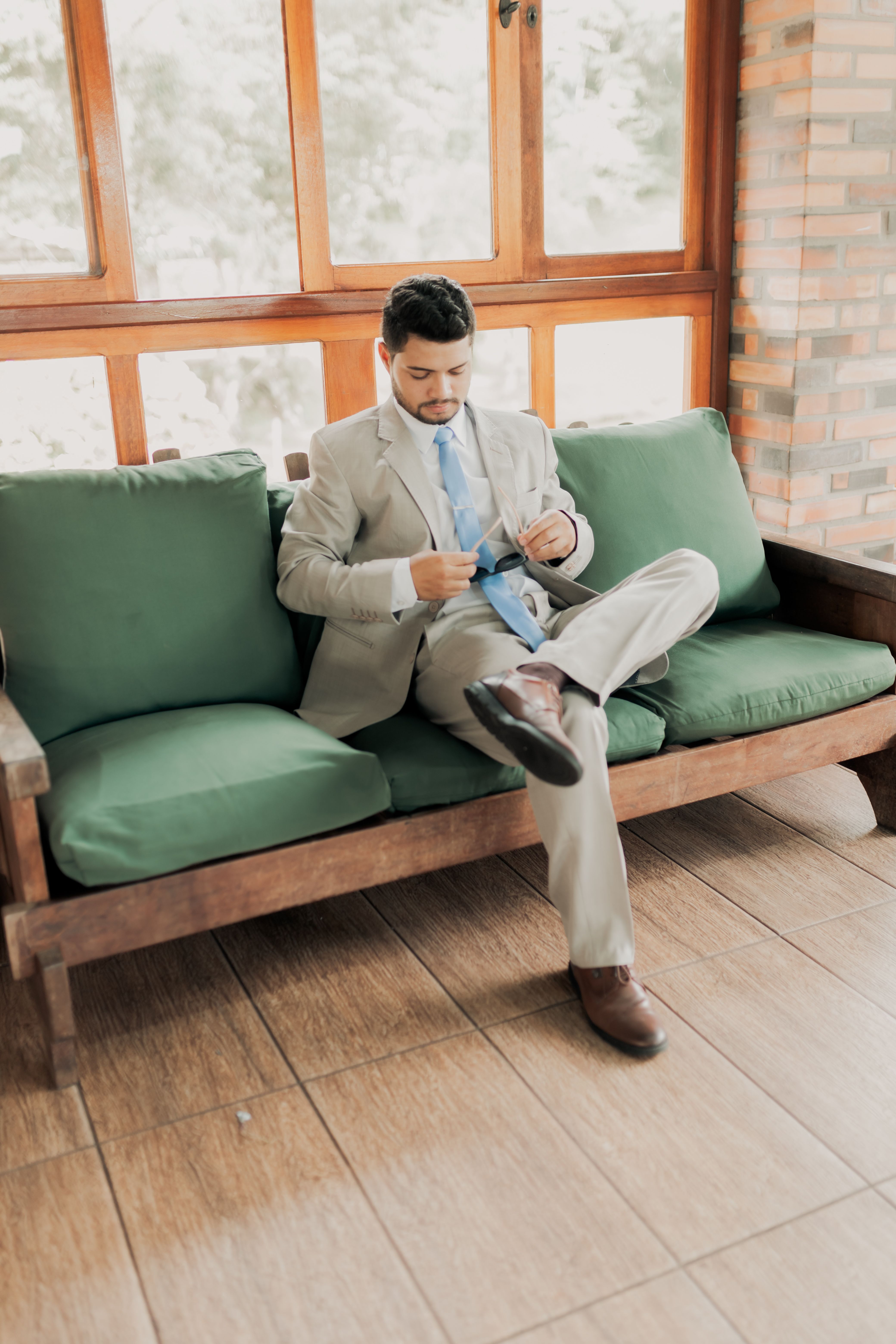 Businessman Relaxing in a Stylish Suit Indoors · Free Stock Photo
