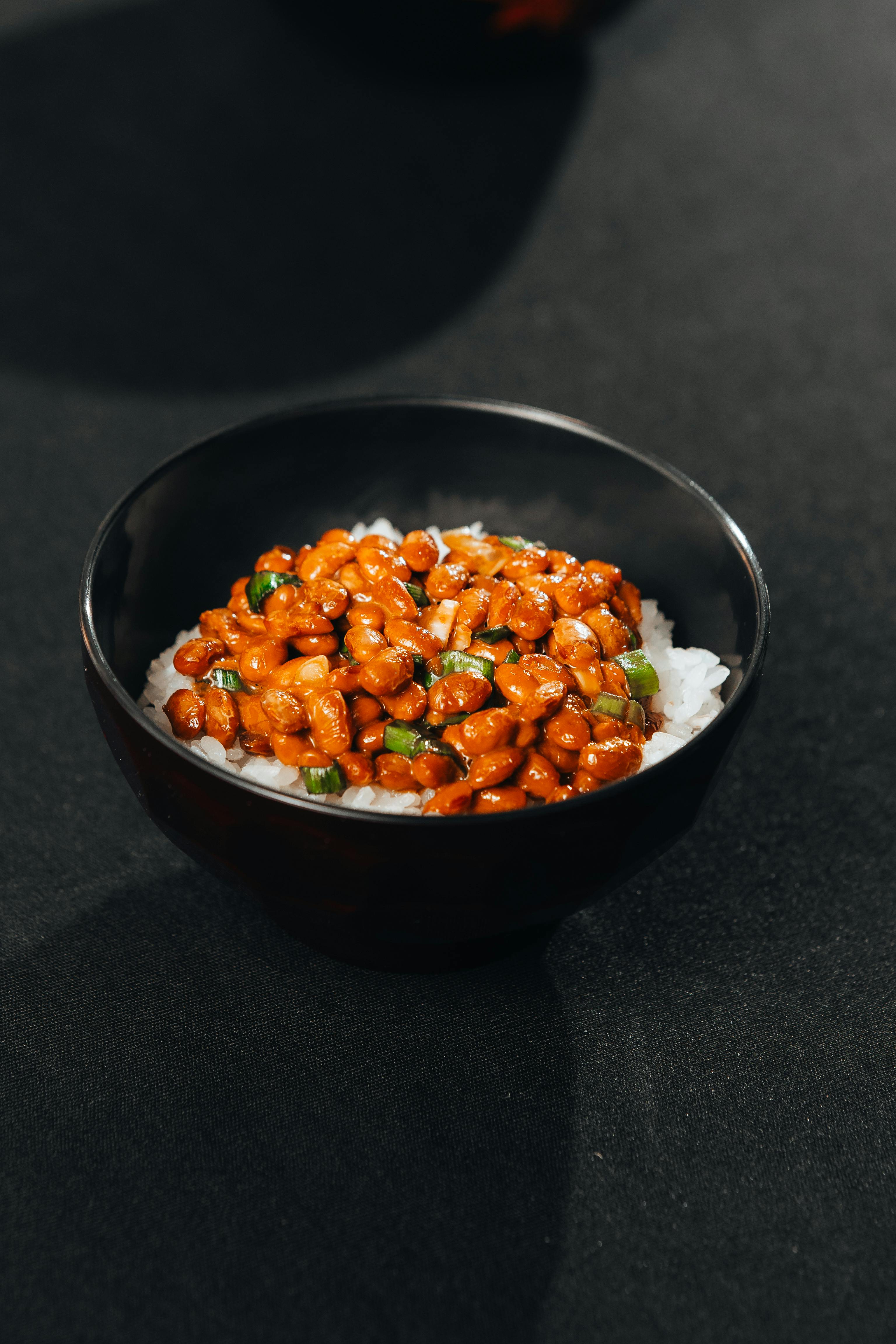 Delicious Japanese Natto Rice Bowl on Black Surface · Free Stock Photo