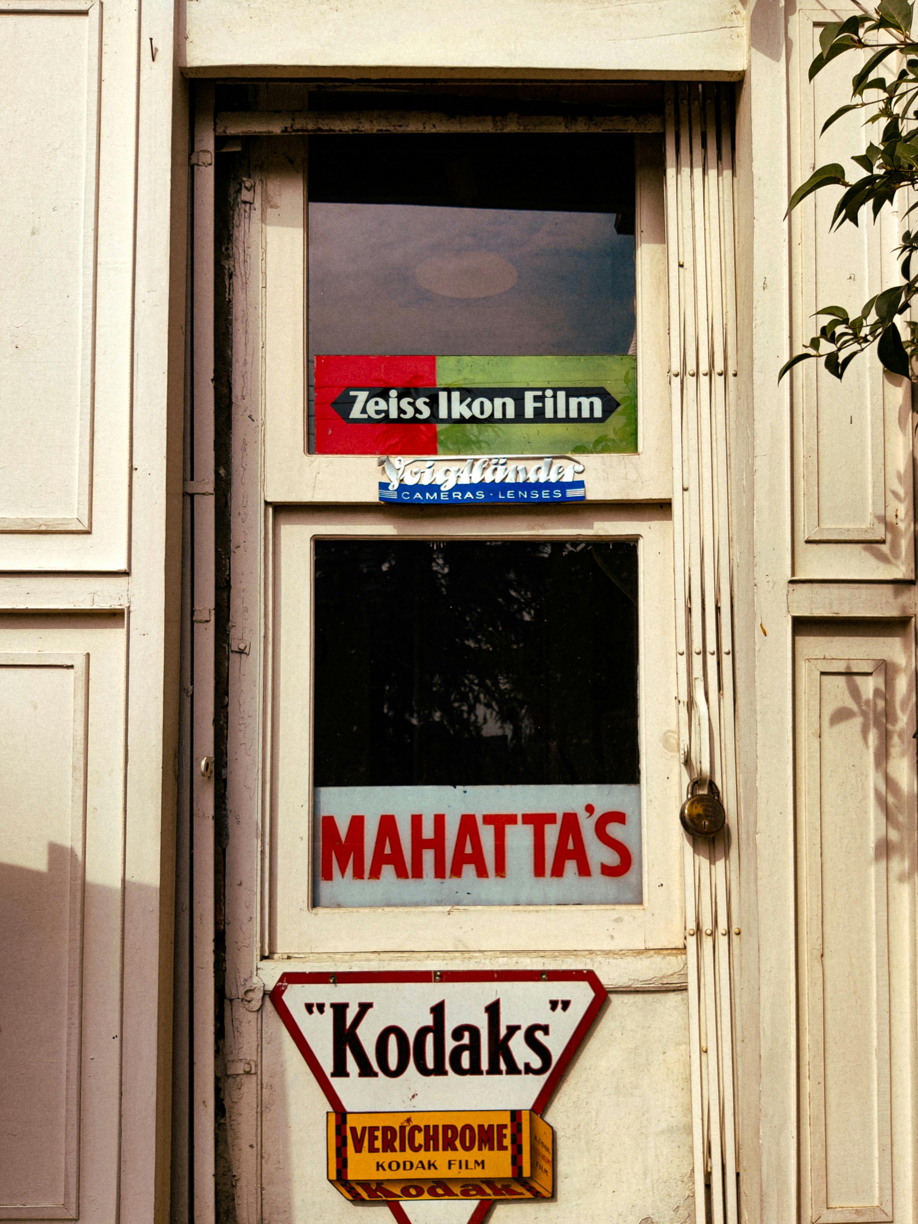 Vintage Film Storefront with Retro Signage · Free Stock Photo