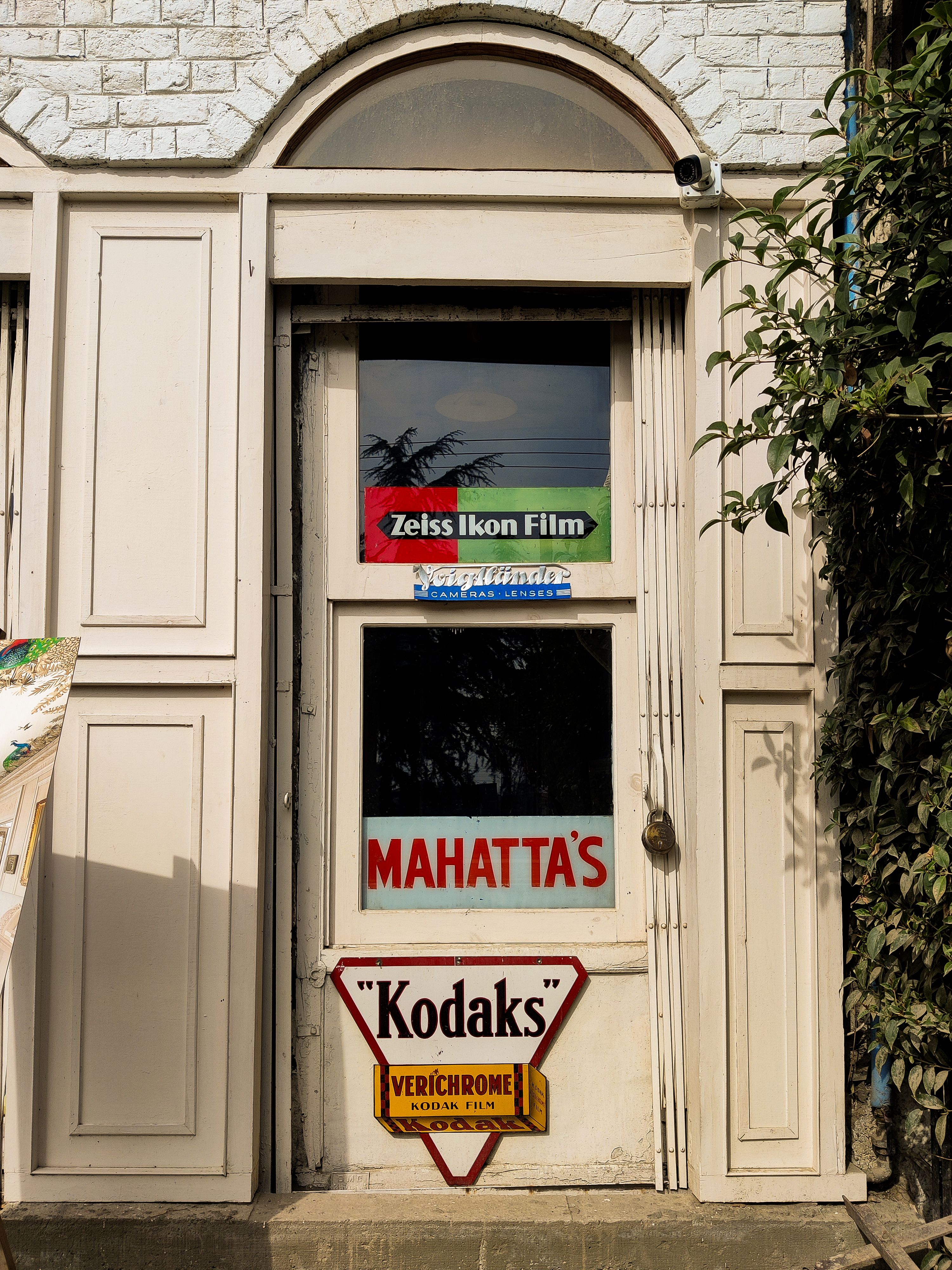 Vintage Film Storefront with Retro Signage · Free Stock Photo