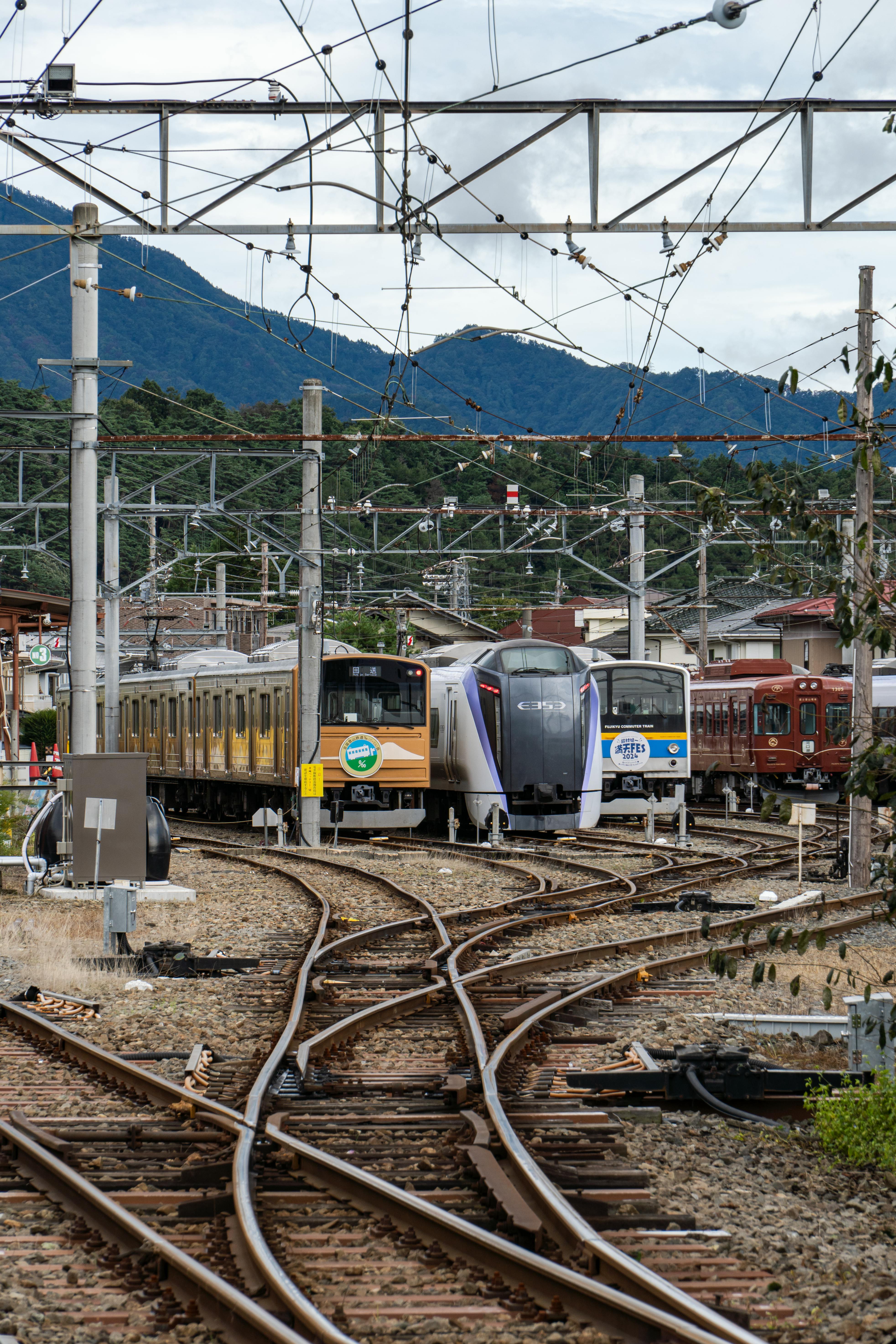 Colorful Trains at Busy Railway Intersection · Free Stock Photo