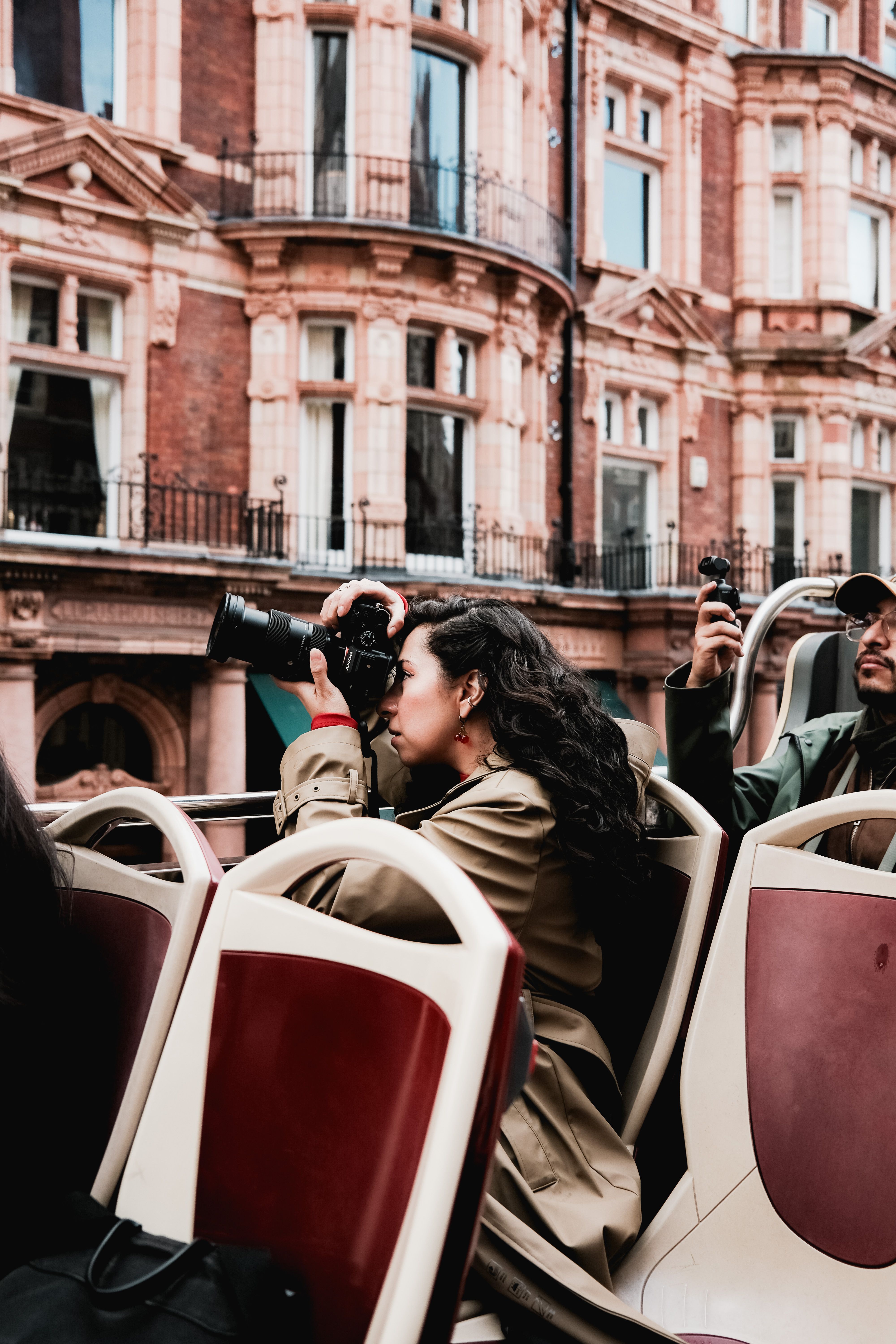 Tourists Capturing Urban Architecture on Double-Decker · Free Stock Photo