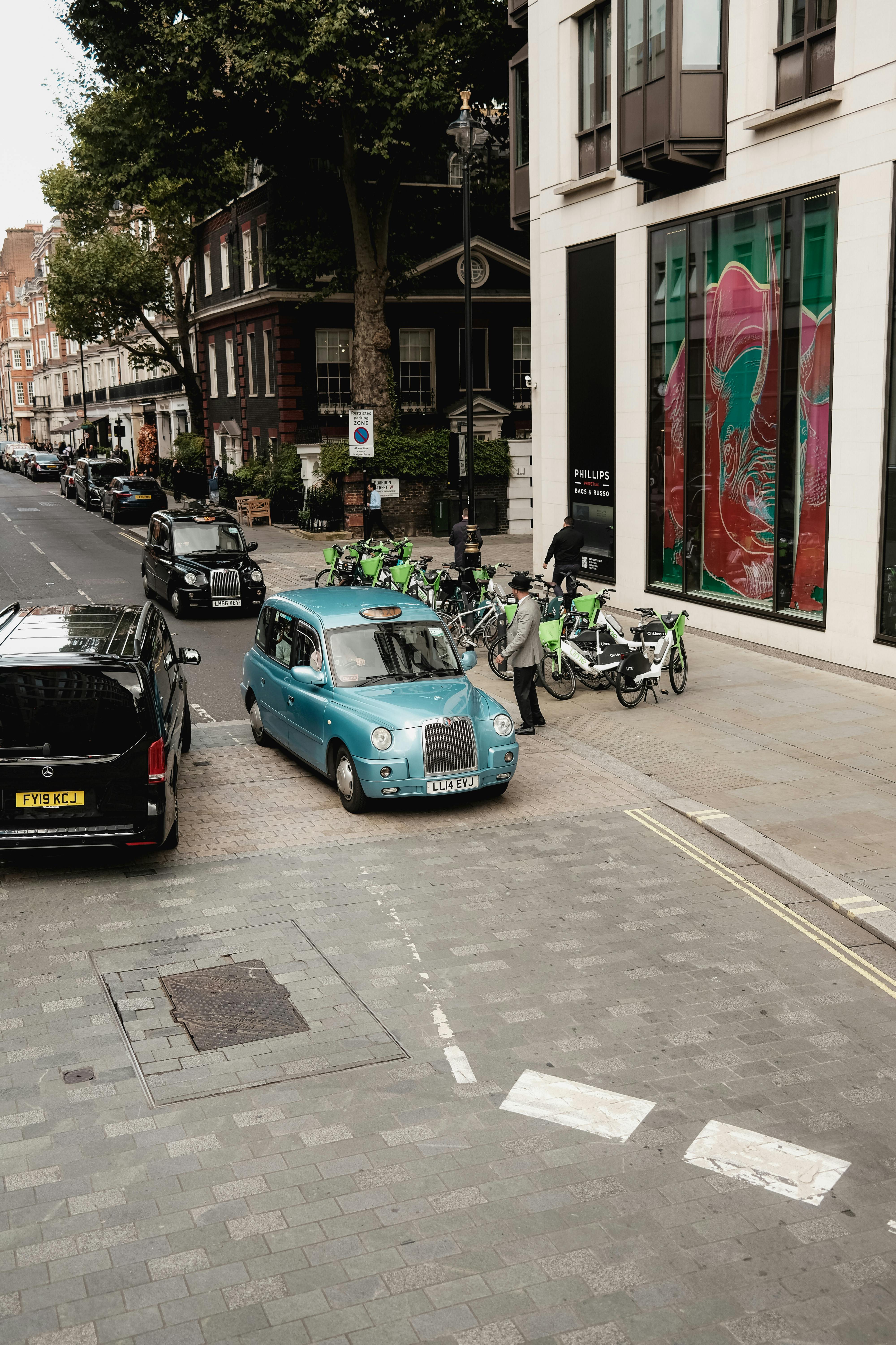 Iconic London Street with Classic Taxi Cab · Free Stock Photo