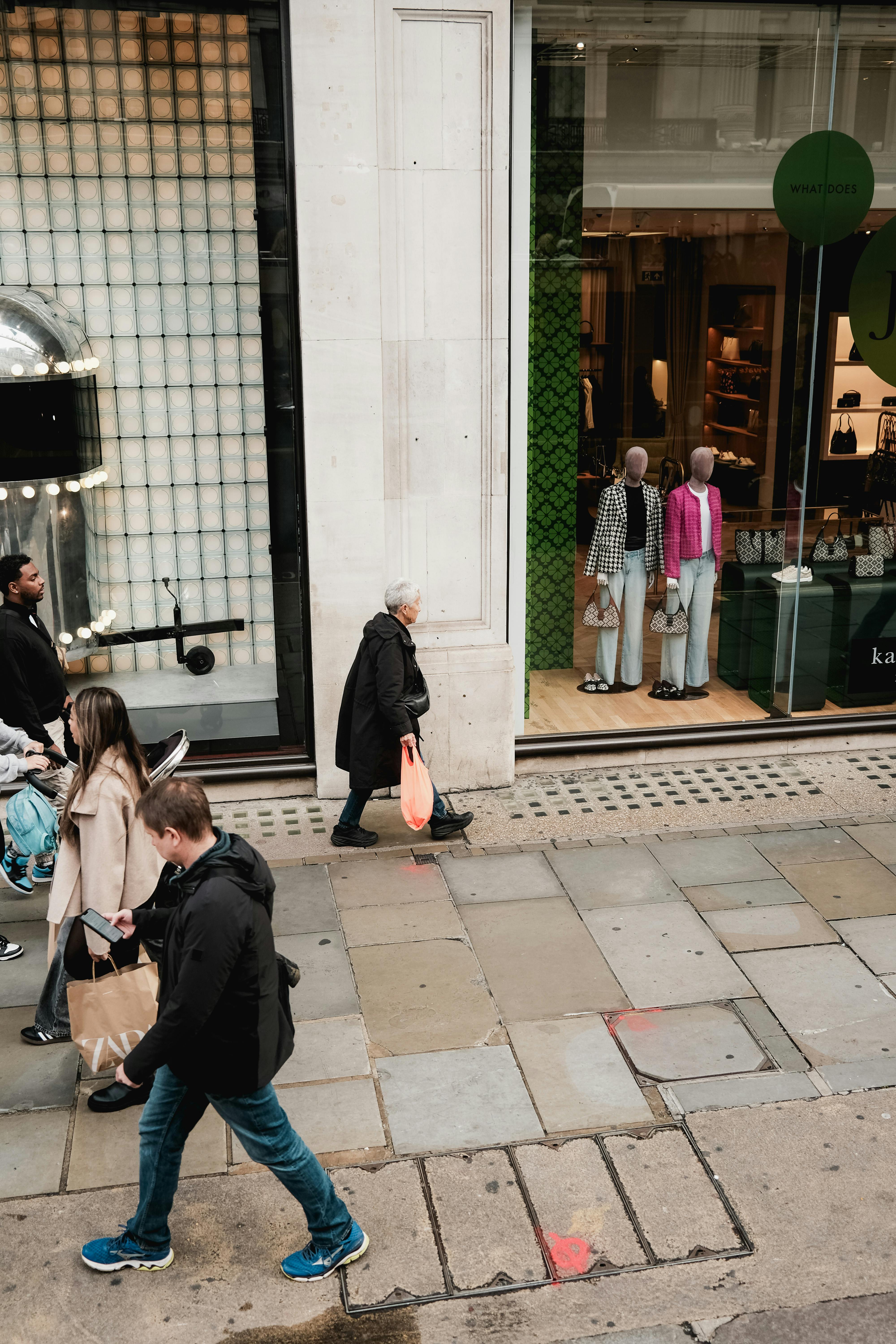 City Street Scene with Pedestrians and Storefront · Free Stock Photo