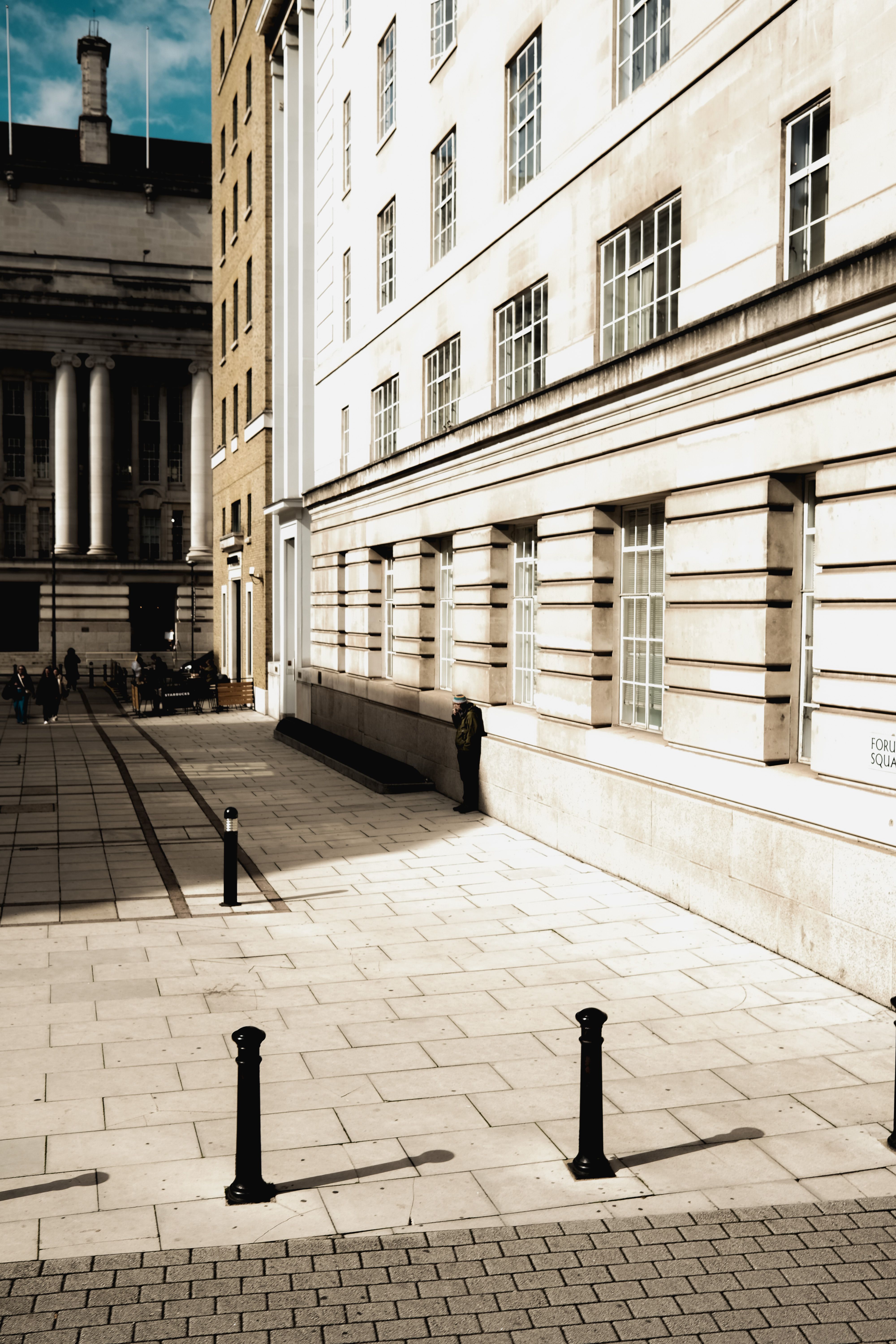 Urban Architectural Street View with Shadows · Free Stock Photo