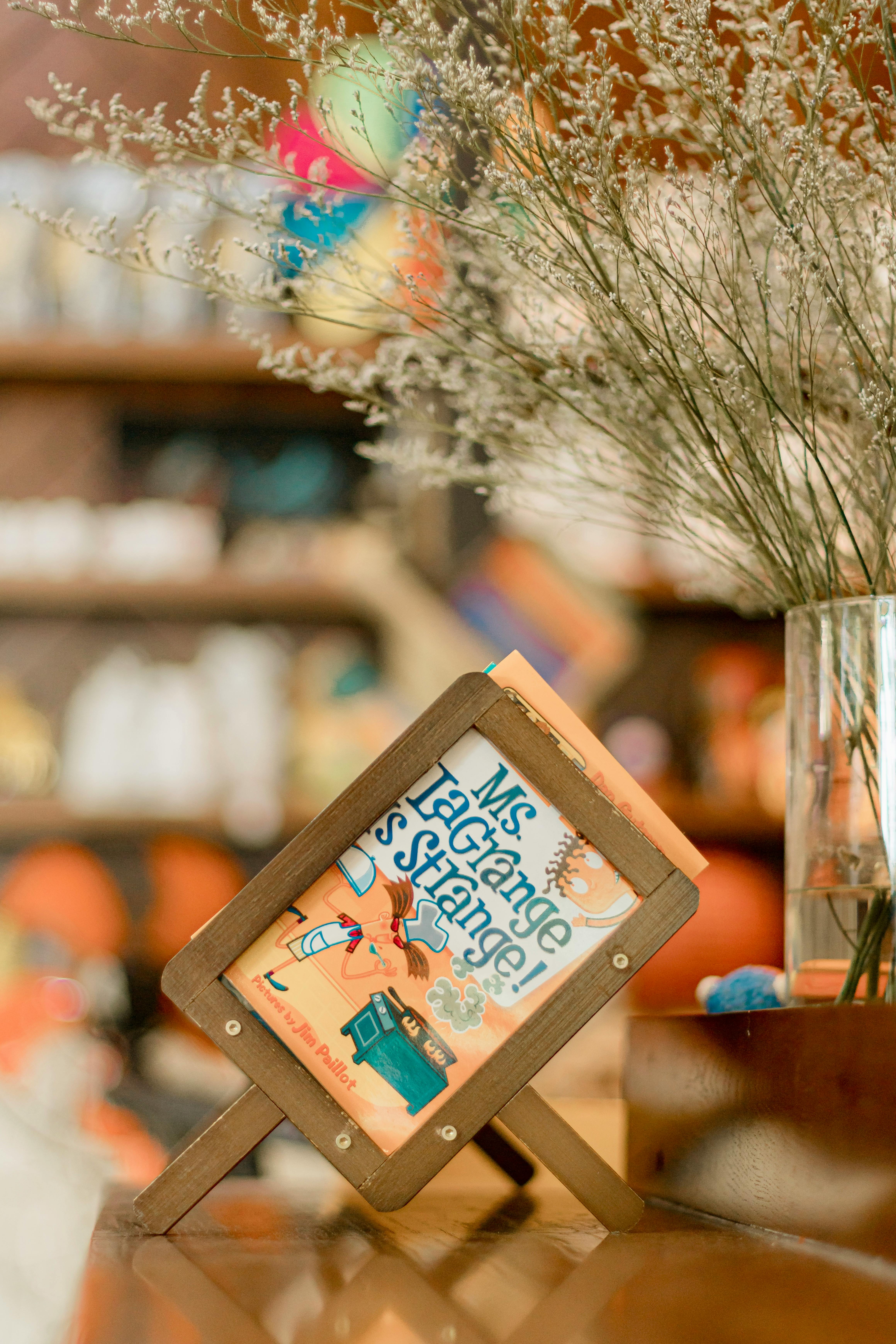 Vintage Book Display with Wildflowers · Free Stock Photo