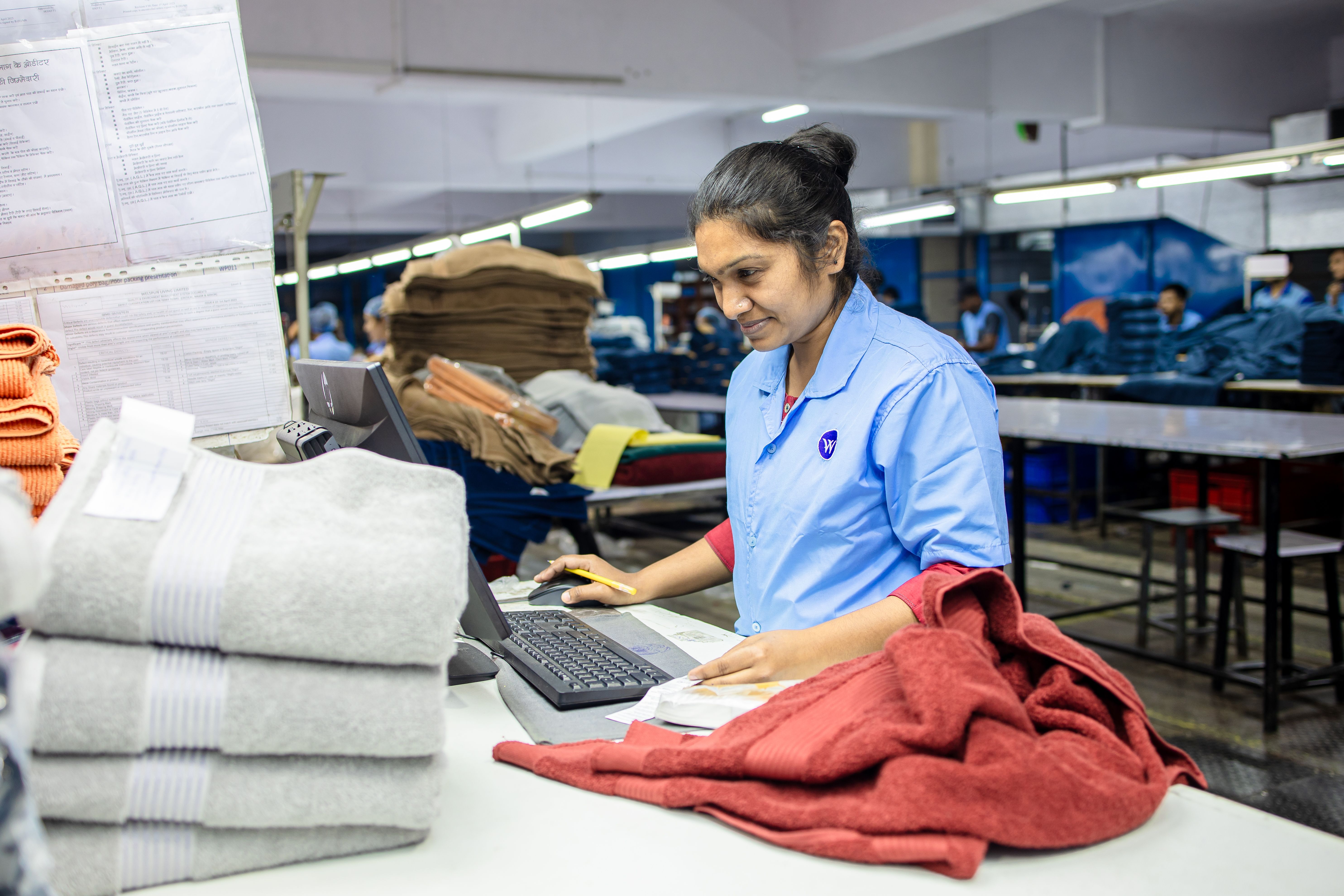 Efficient Textile Worker Inspecting Fabrics · Free Stock Photo