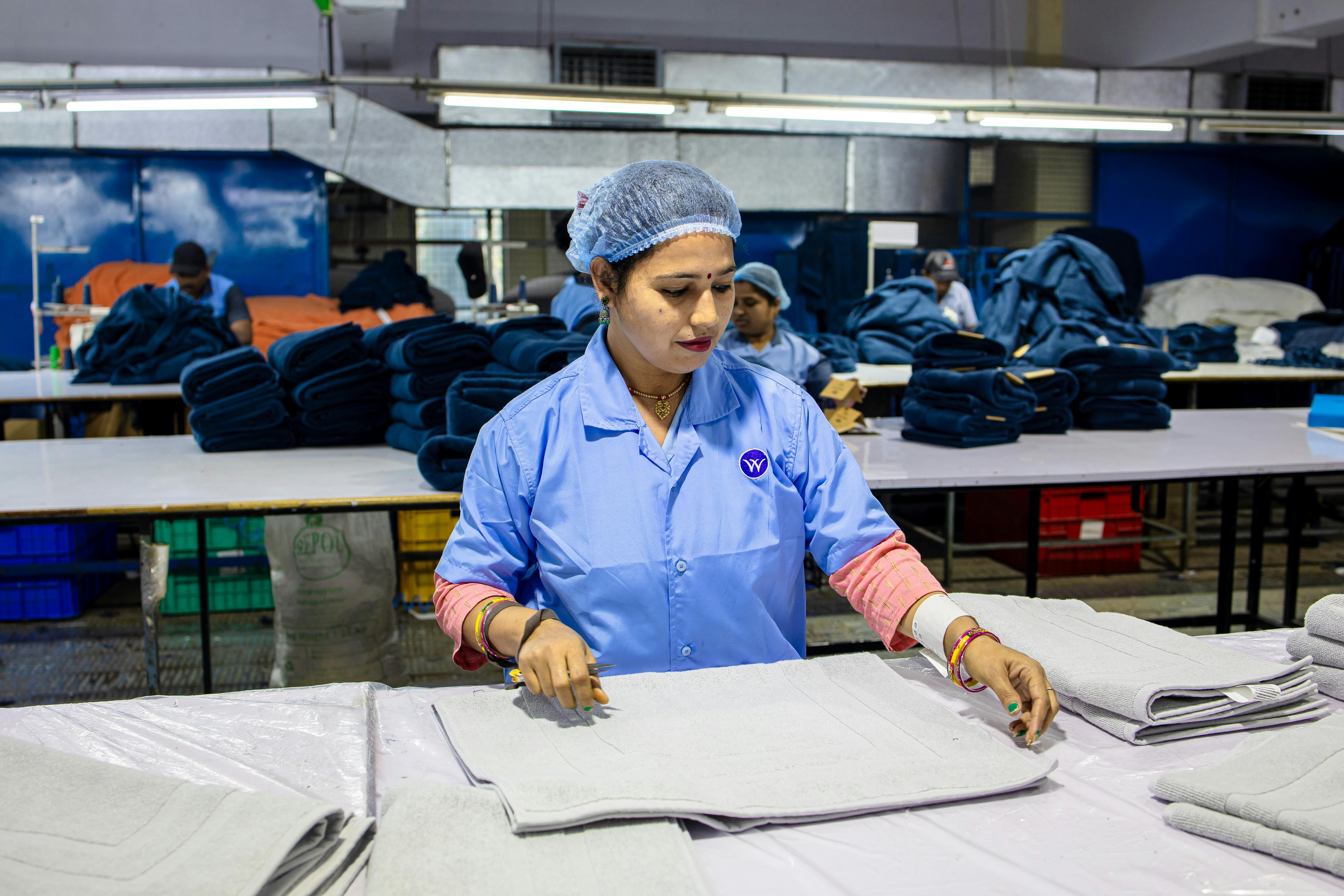 Female Textile Worker in Production Facility · Free Stock Photo