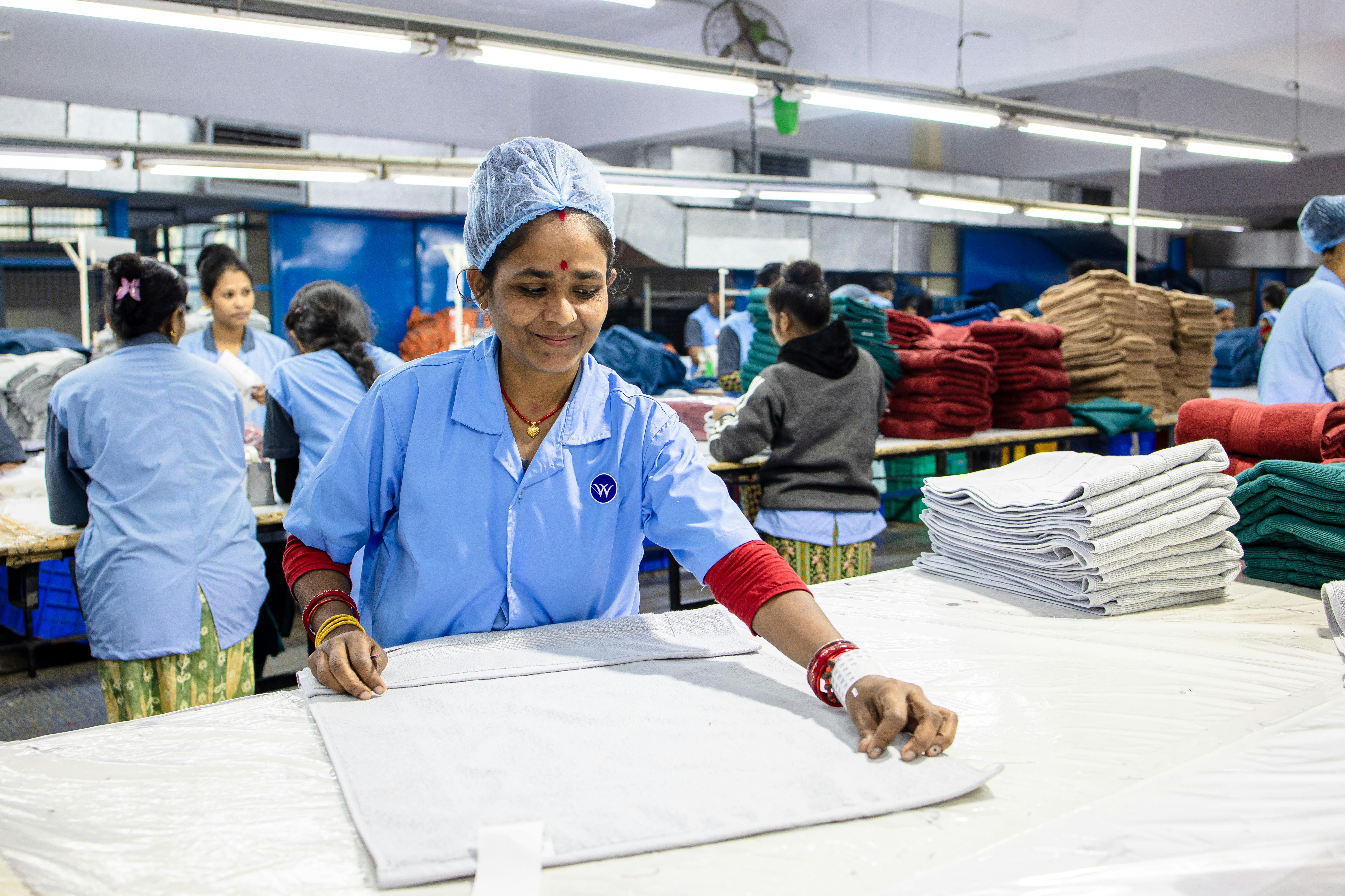 Indian Textile Factory Workers Sorting Fabrics · Free Stock Photo