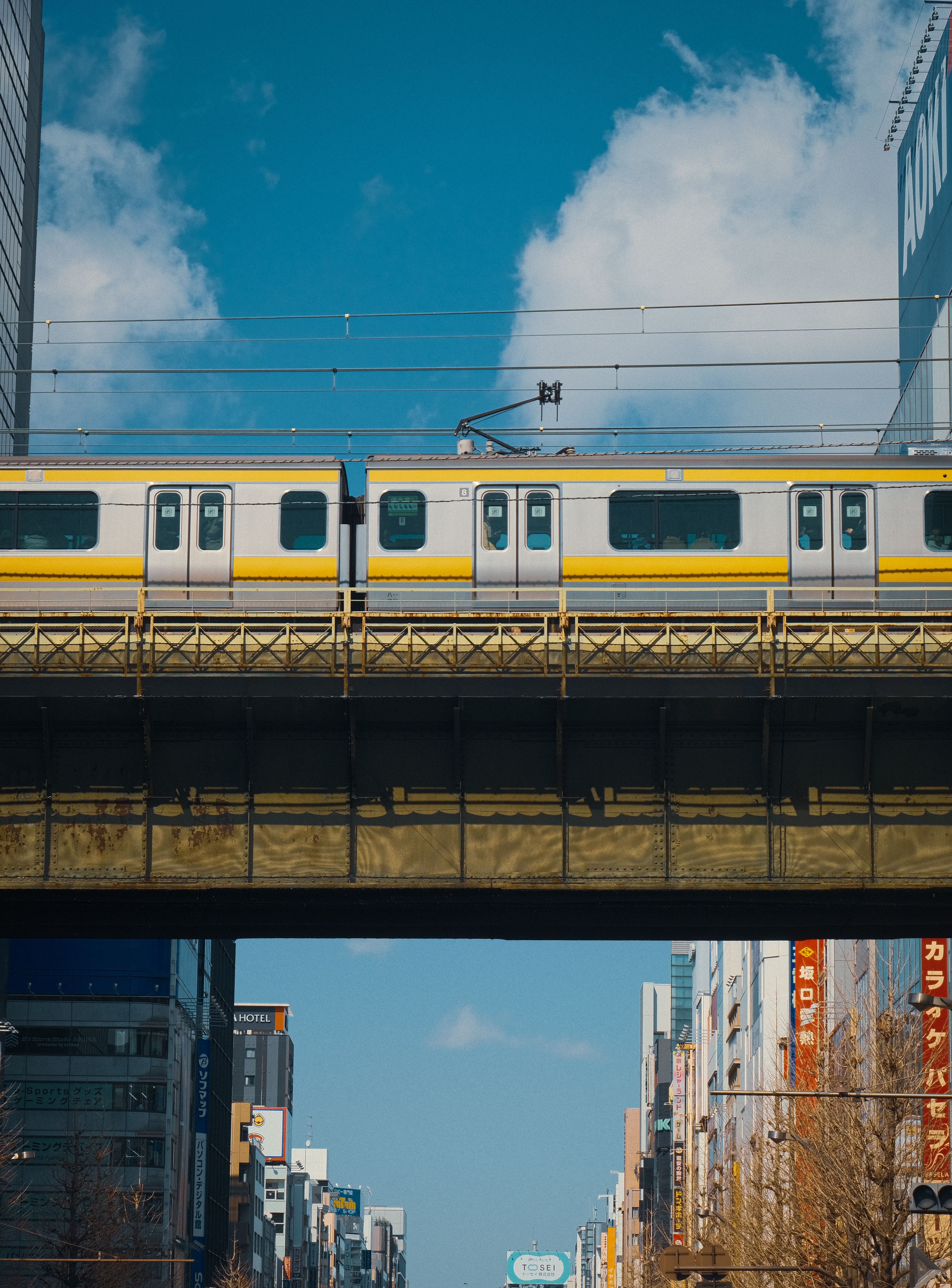 Urban Train on Elevated Track in a Cityscape · Free Stock Photo